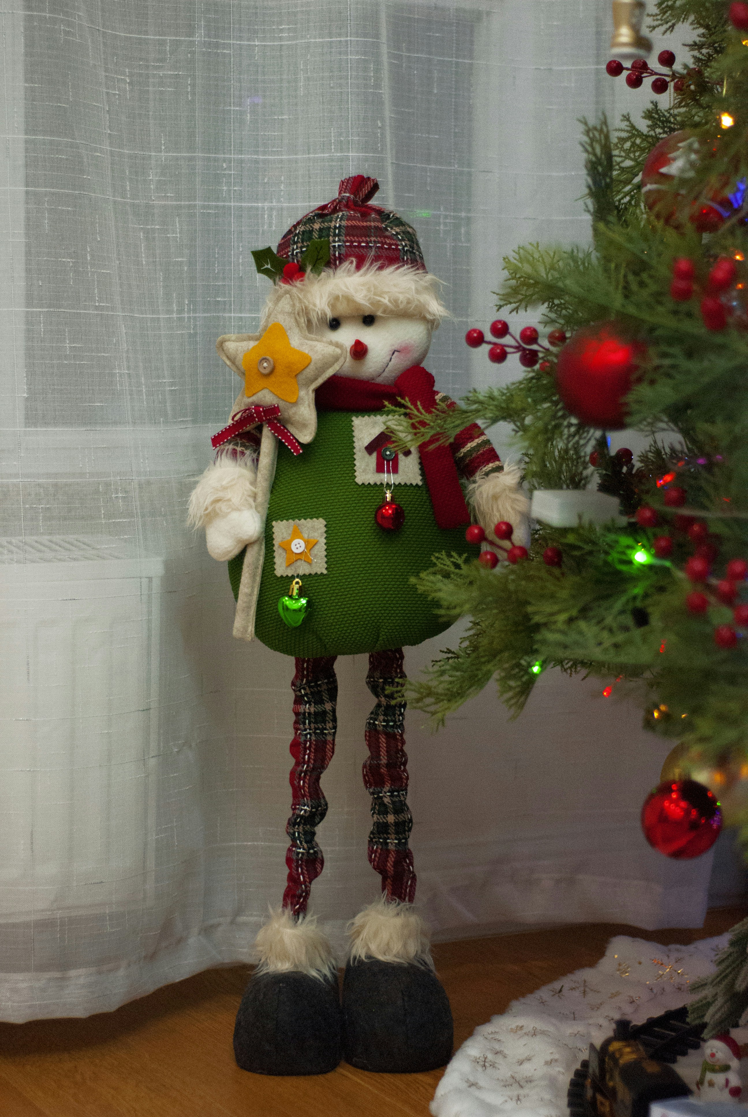 Festive Snowman Marionette Guarding a Christmas Tree