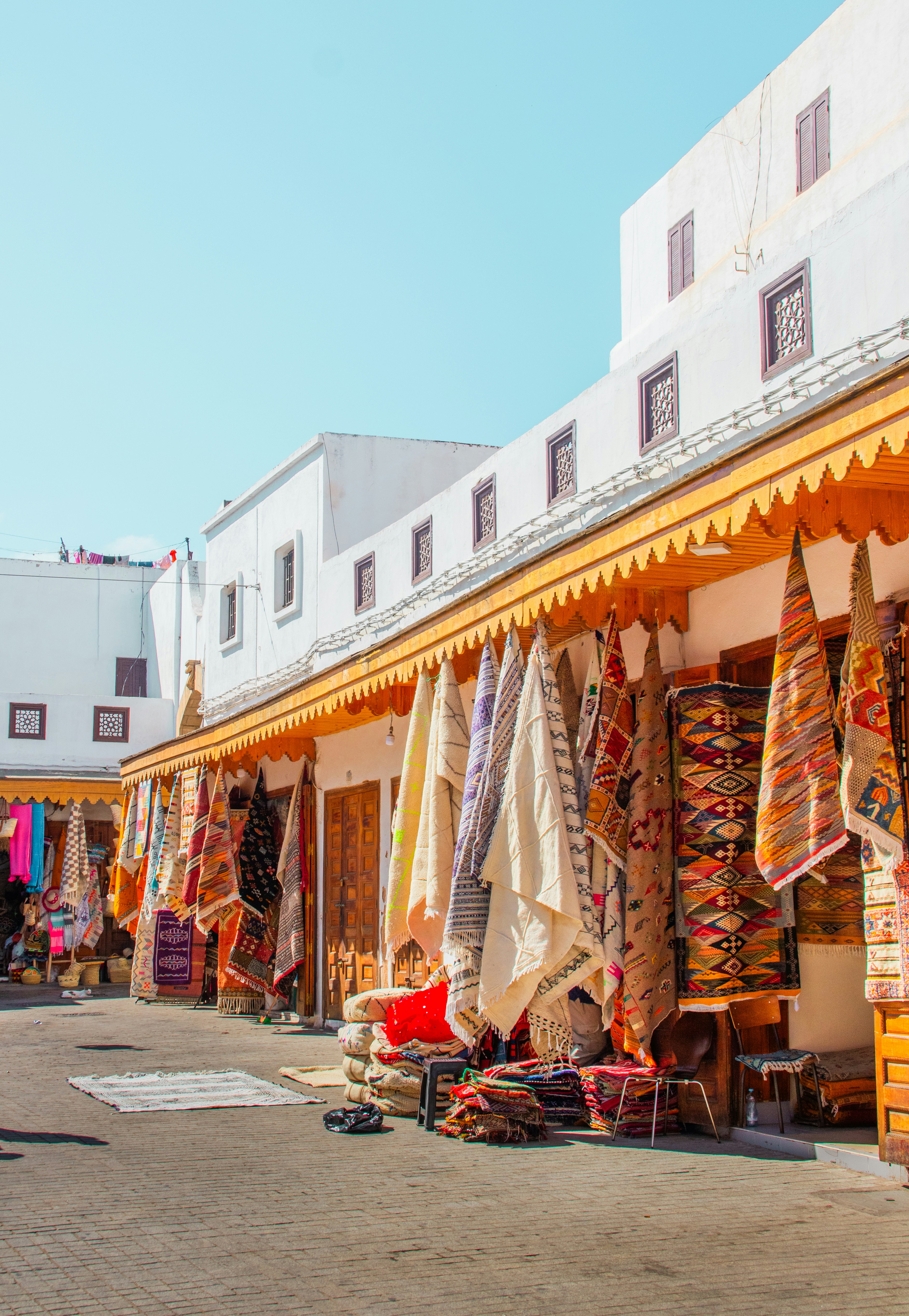A row of shops on the side of a street photo – Free Building Image on ...
