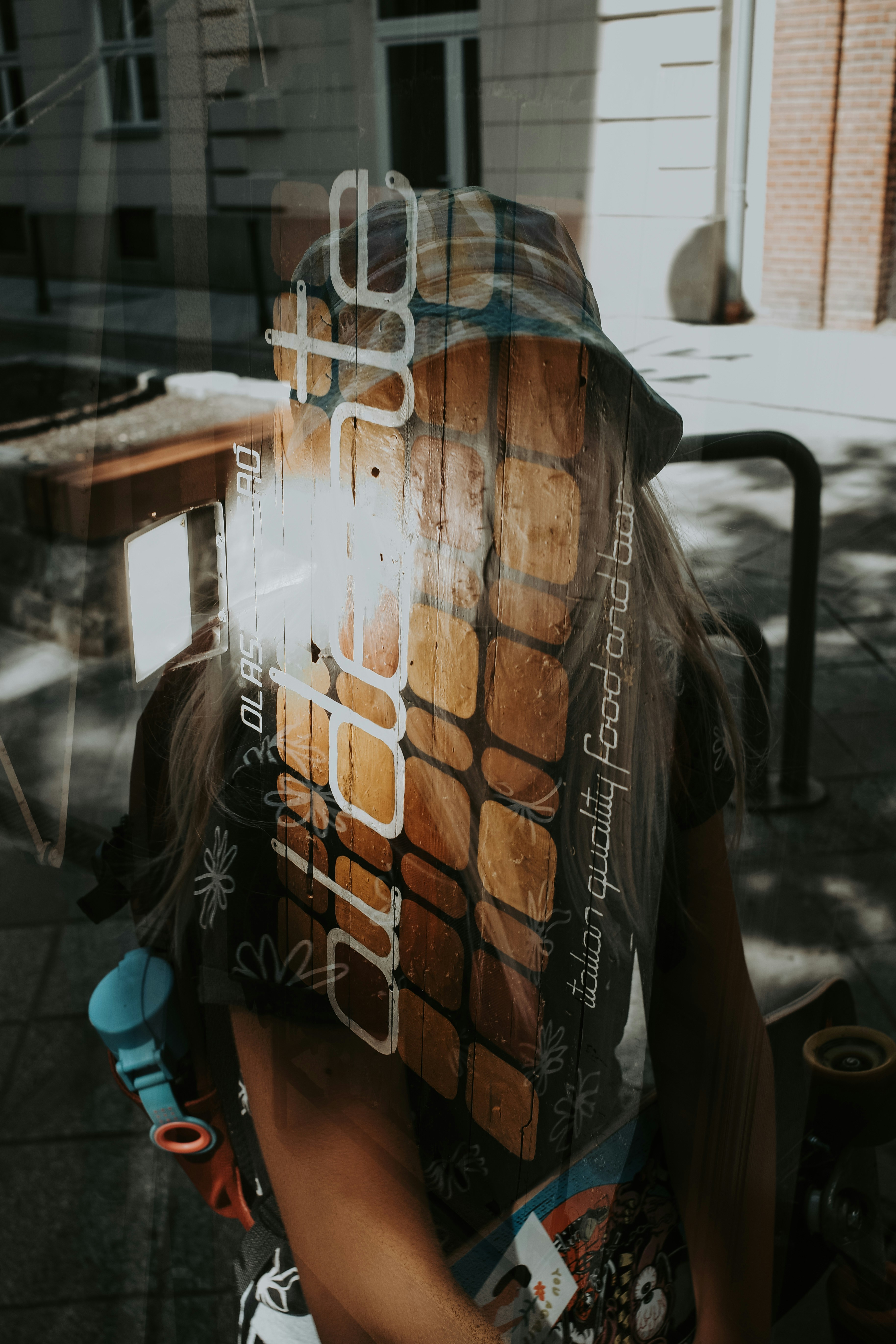 A person carrying a box of doughnuts on their back photo – Free Food ...