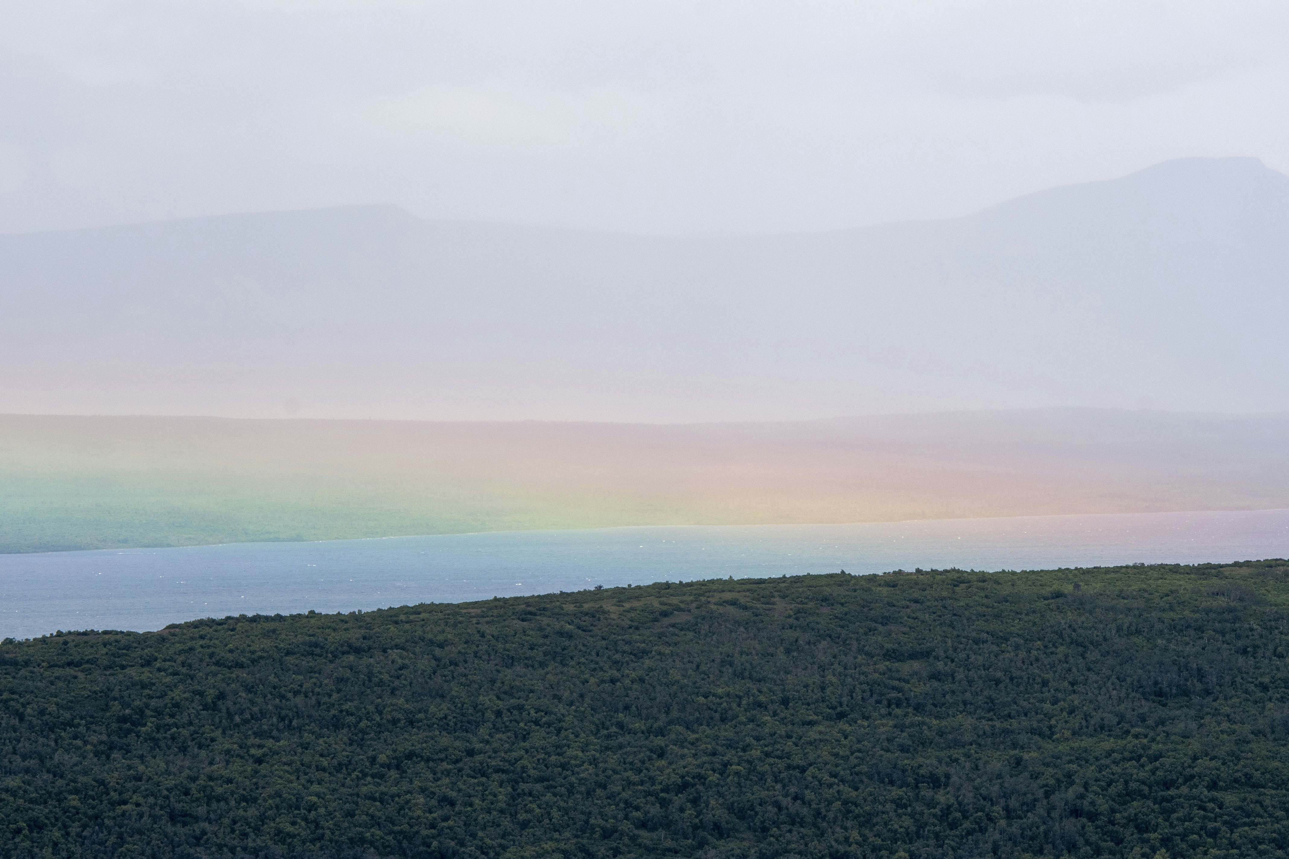 Pastel Arc Across a Misty Horizon