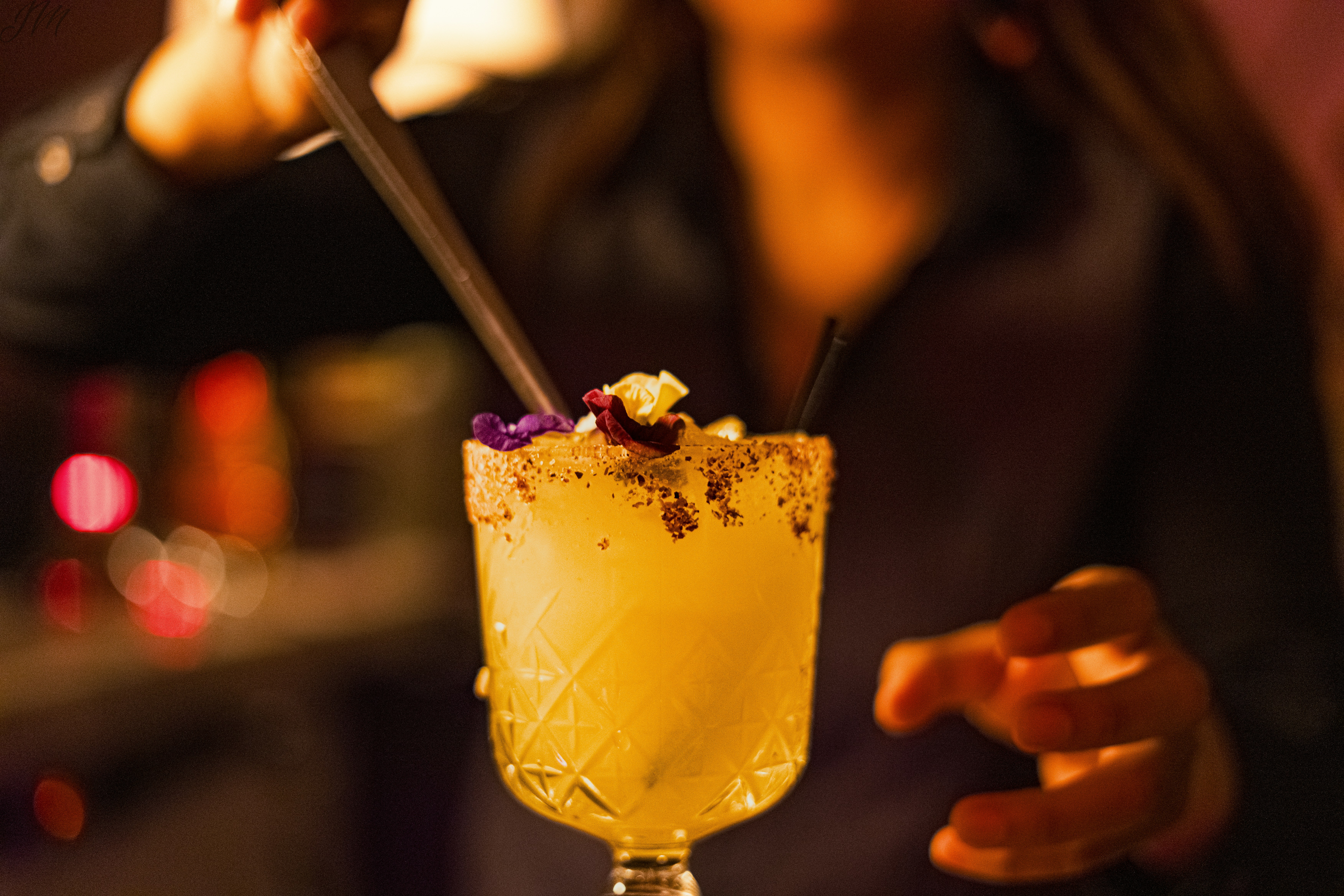 A woman holding a drink in her hand photo – Free Foxtail lounge ...