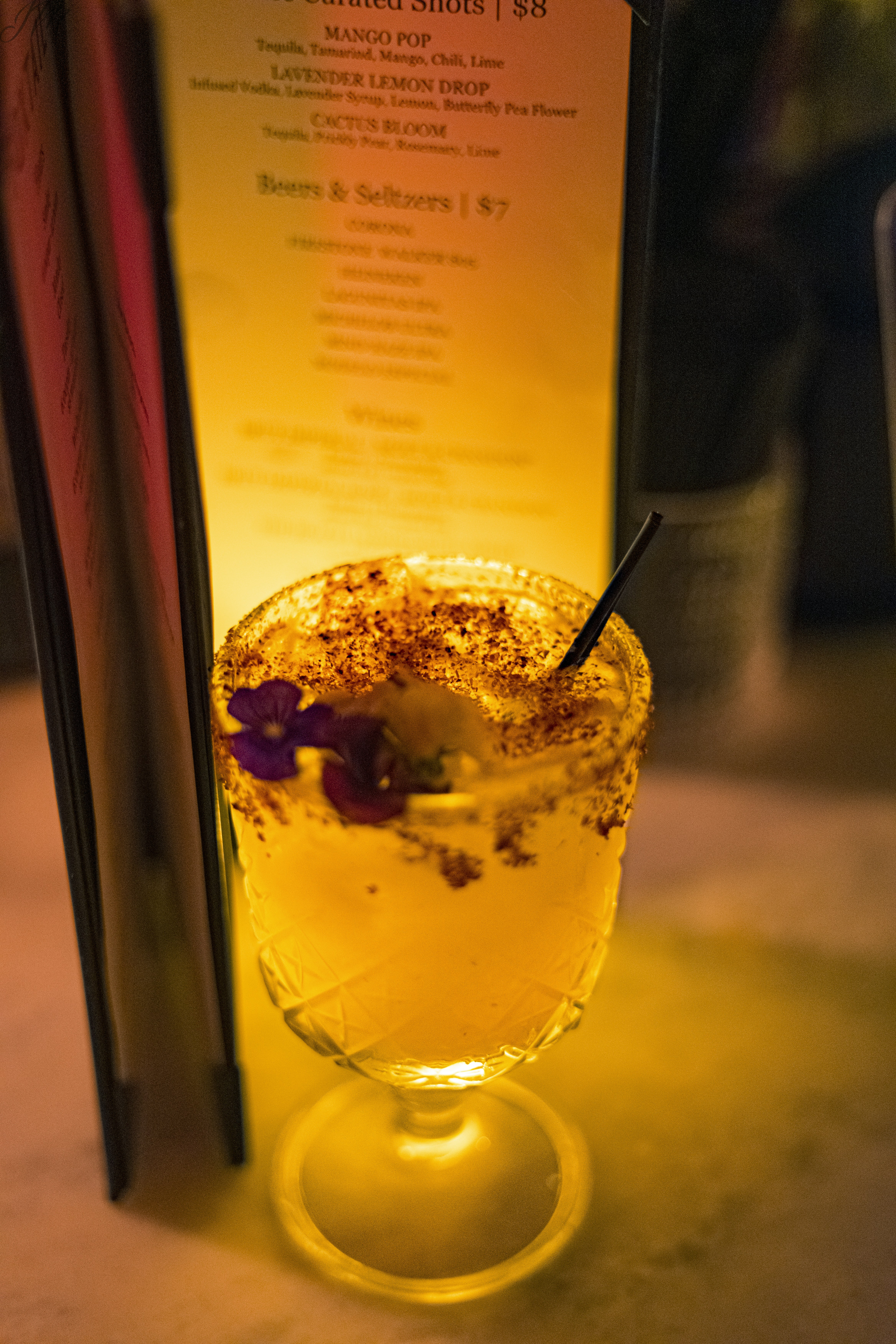 A drink sitting on top of a table next to a menu photo – Free Foxtail ...