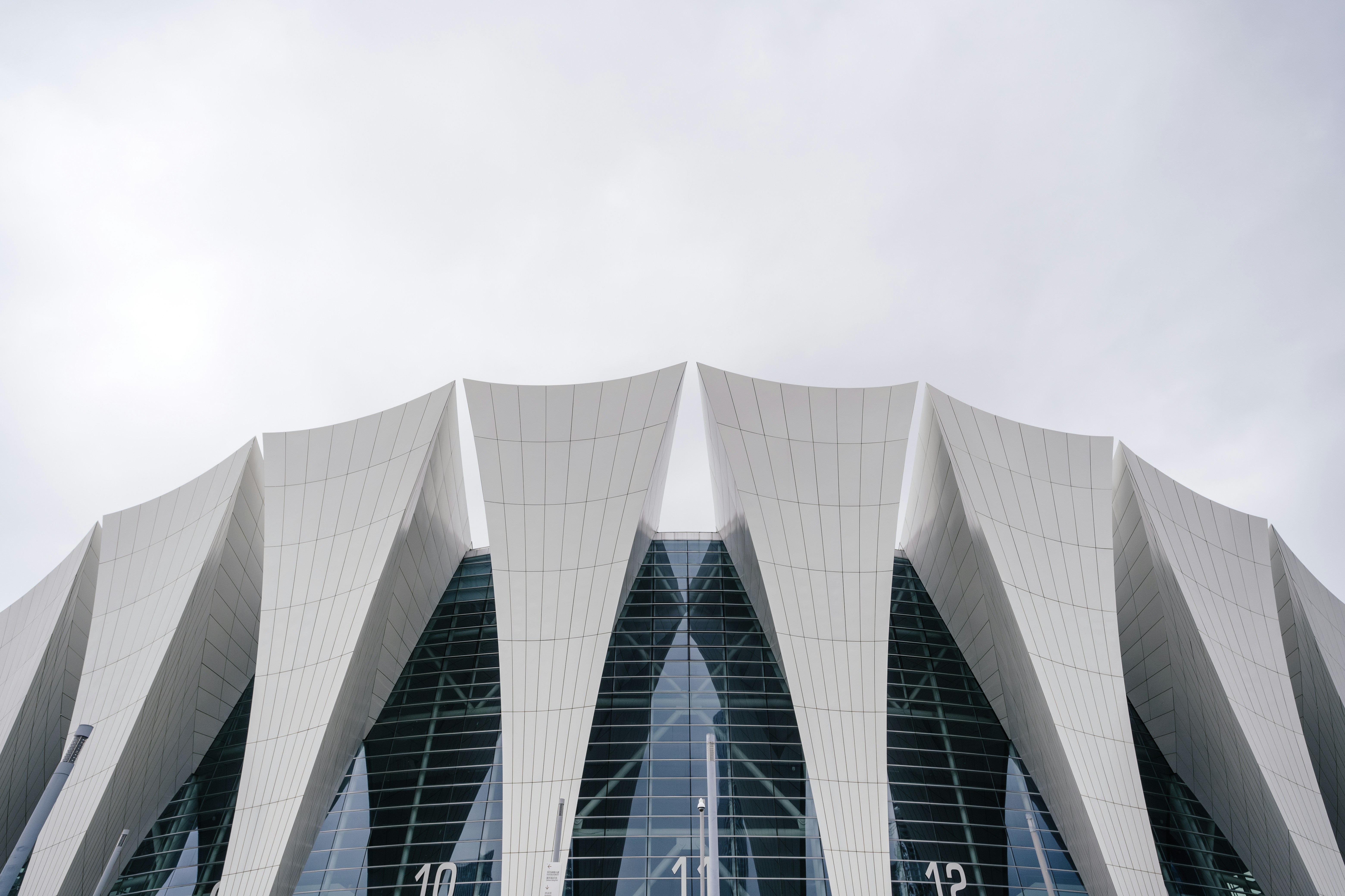 A large building with a very tall roof photo – Free Office Image on ...