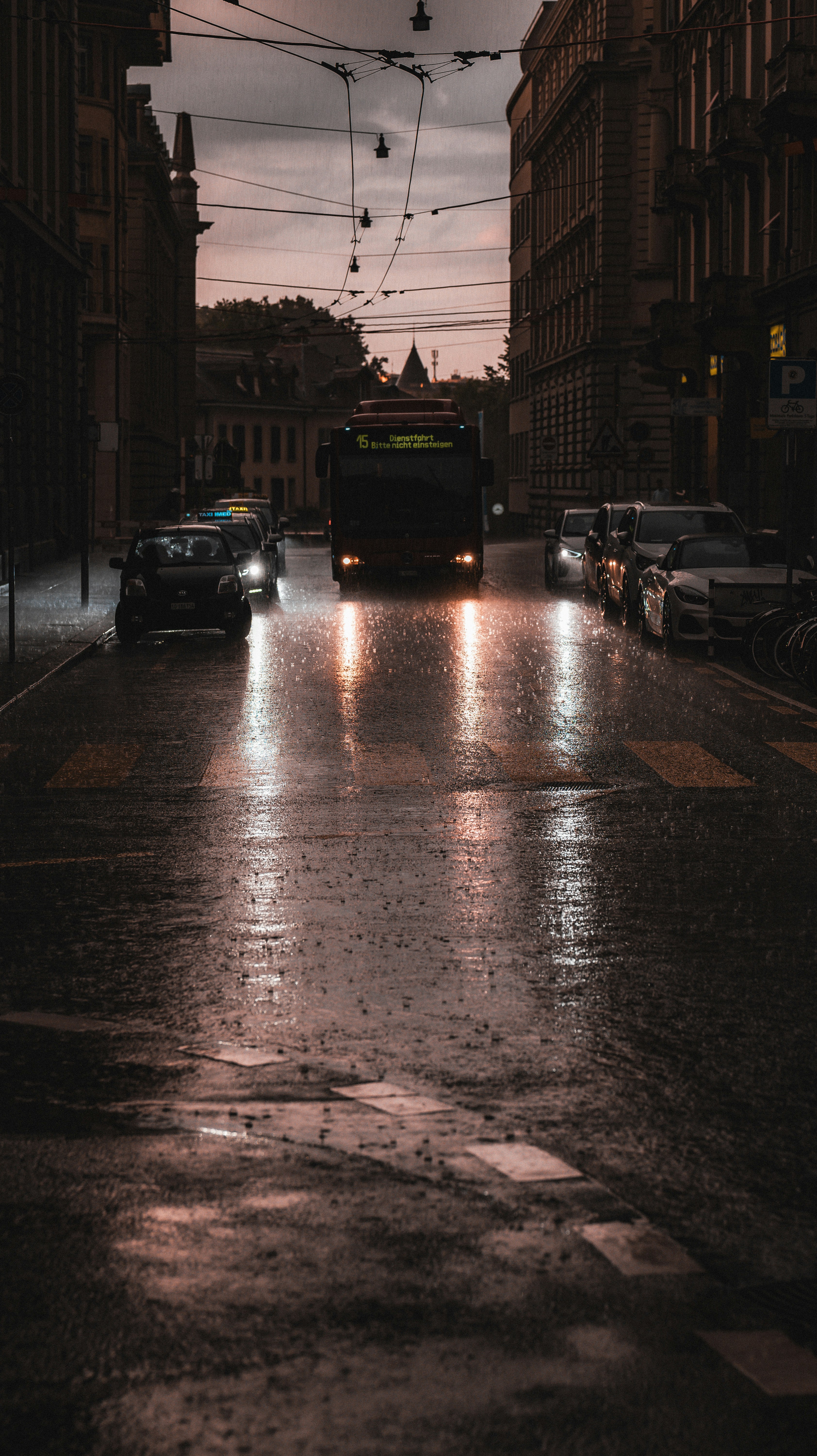 Rain-Slick Convergence: A City Bus Pierces Dusk on a Wet Street
