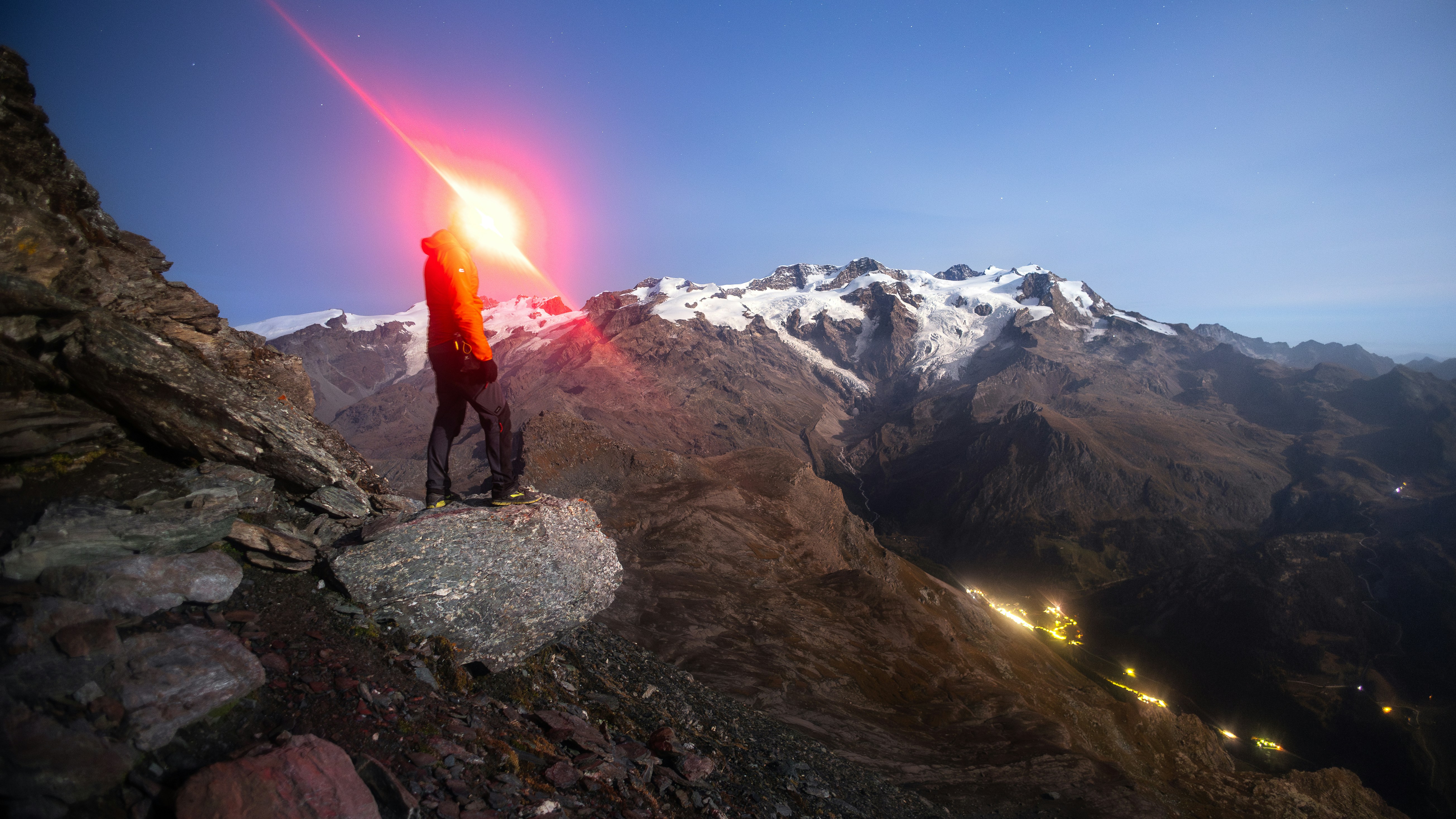 Crimson Beacon on a Moonlit Alpine Ridge