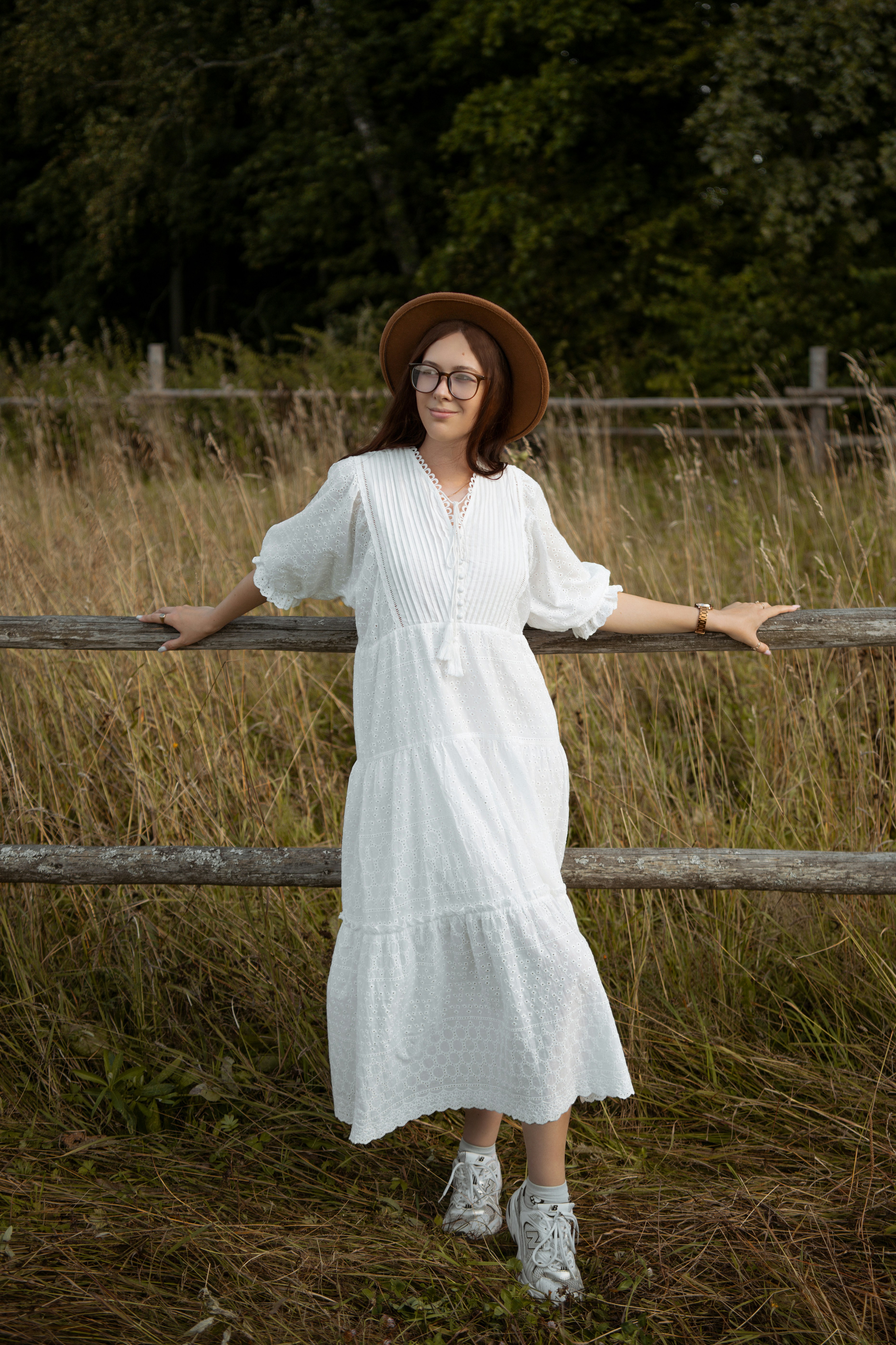 Pastoral Portrait by the Fence: White Dress and Quiet Light