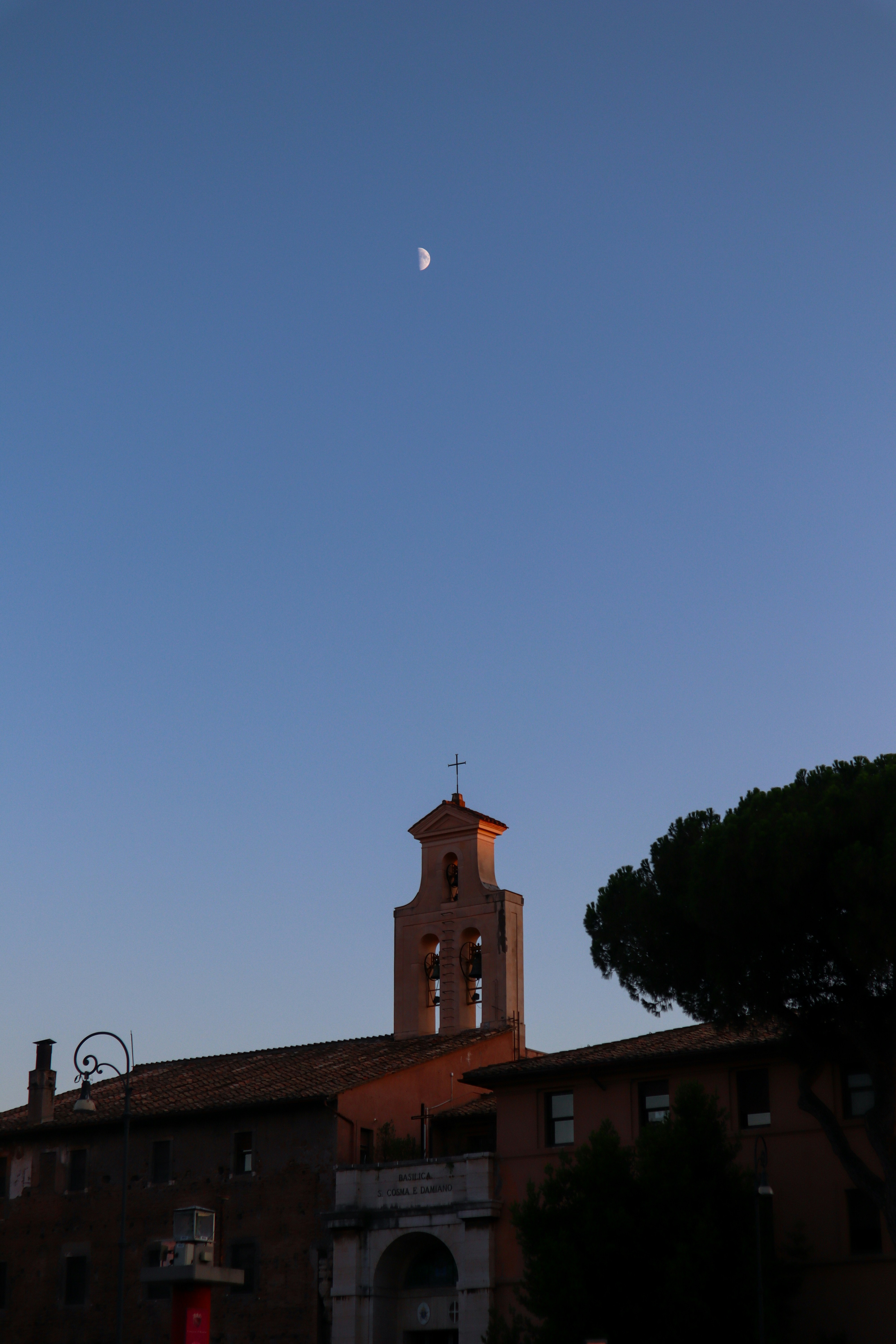 Moonlit Bell Tower Under a Quiet Evening Sky