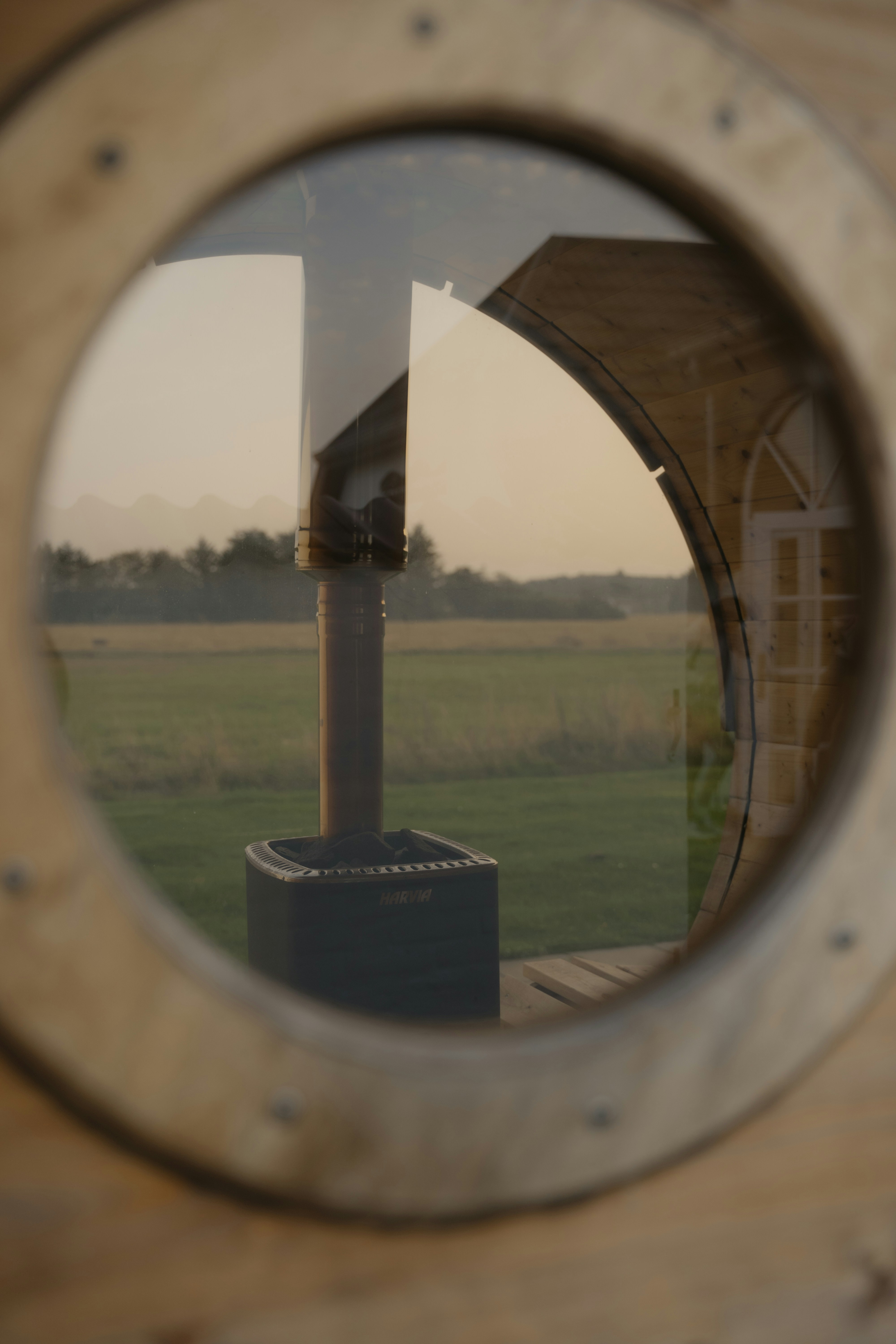 Through a Round Window: Field, Reflection, and Architecture