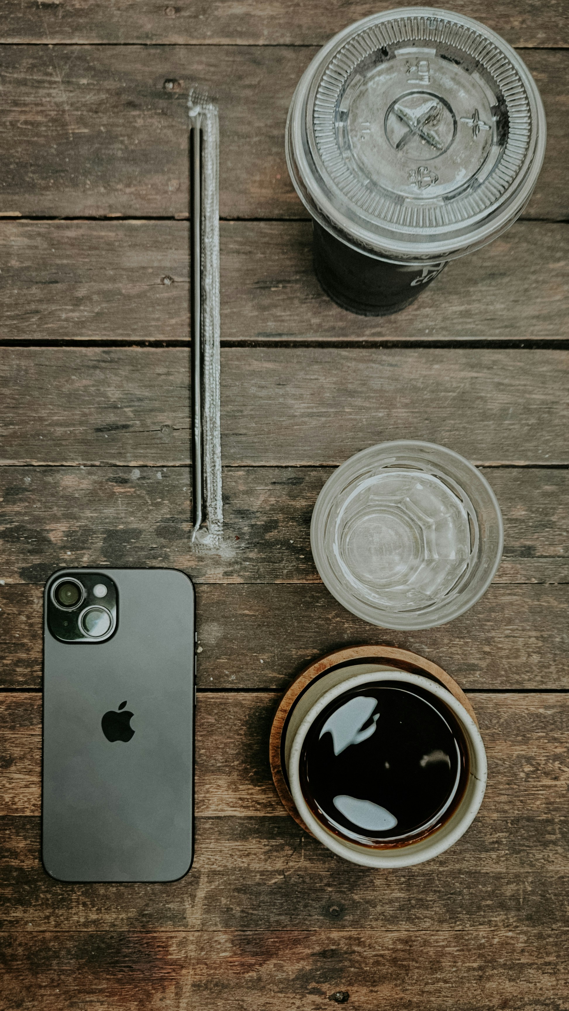 Dark Roast and Modern Echoes: A Top-Down Still-Life on Weathered Wood