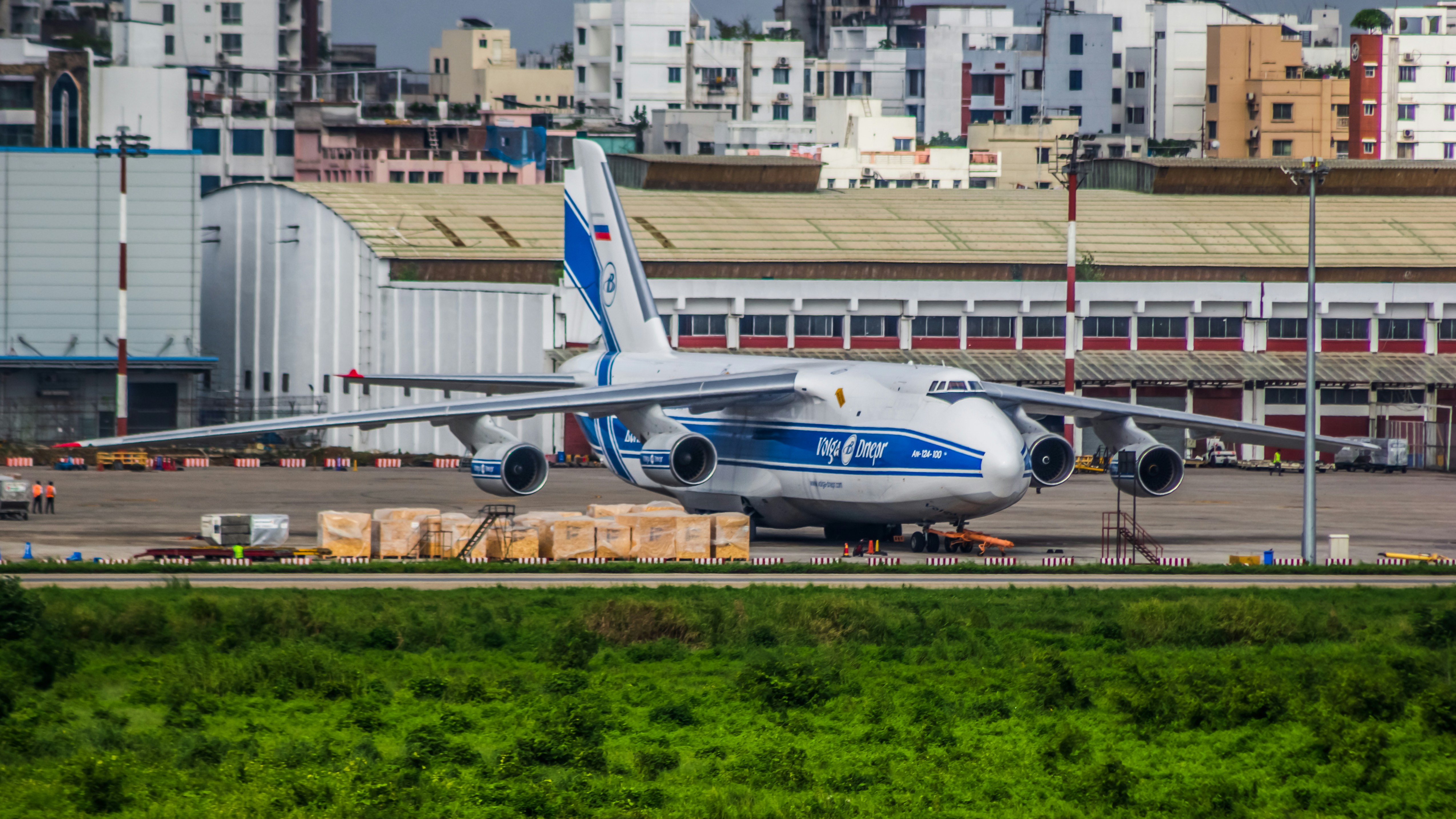 A large jetliner sitting on top of an airport tarmac photo – Free ...