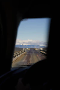 Viewport to the Snowline: A Bridge Stretching Toward Distant Peaks