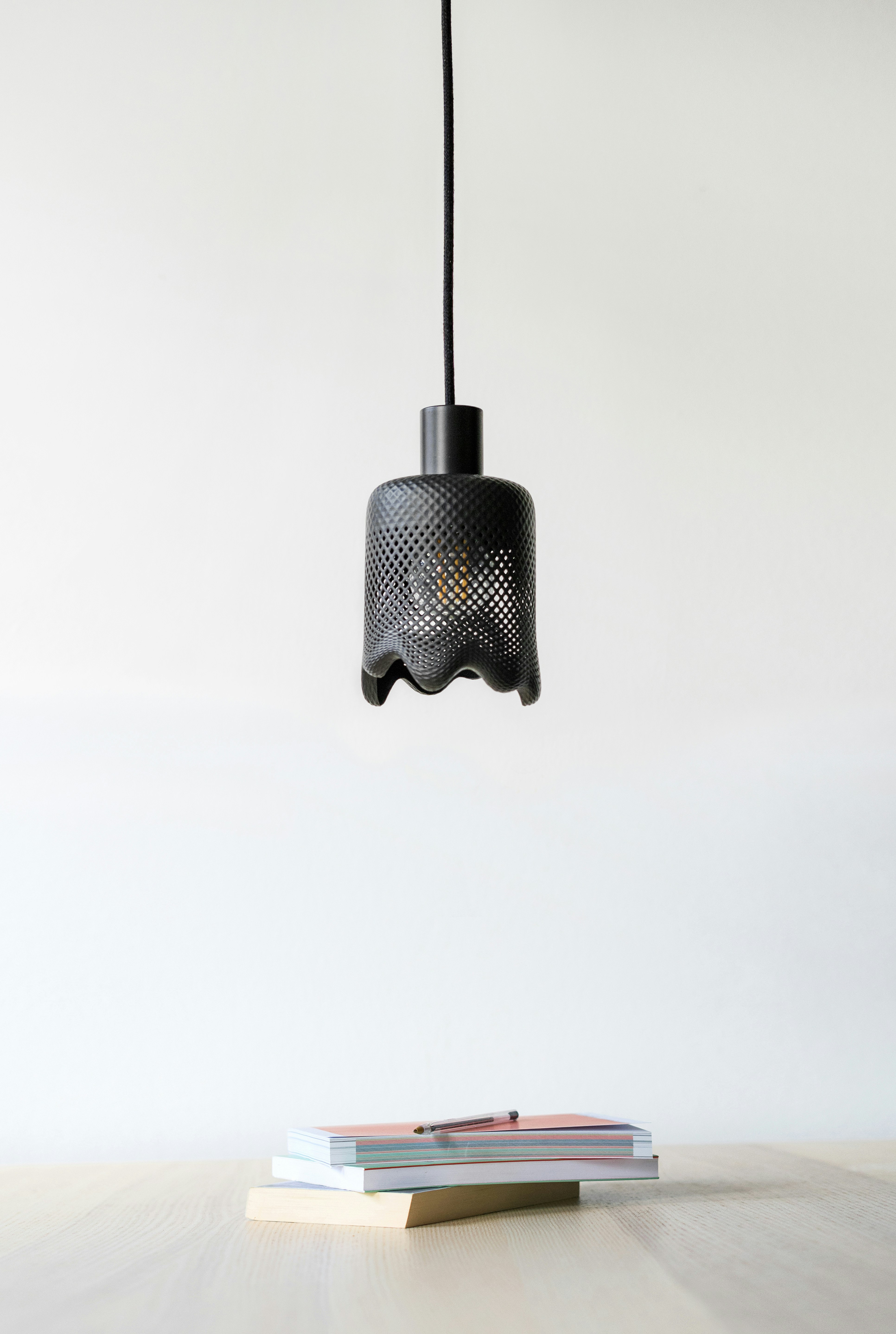Minimalist Glow: A Hanging Pendant Over Quiet Desk