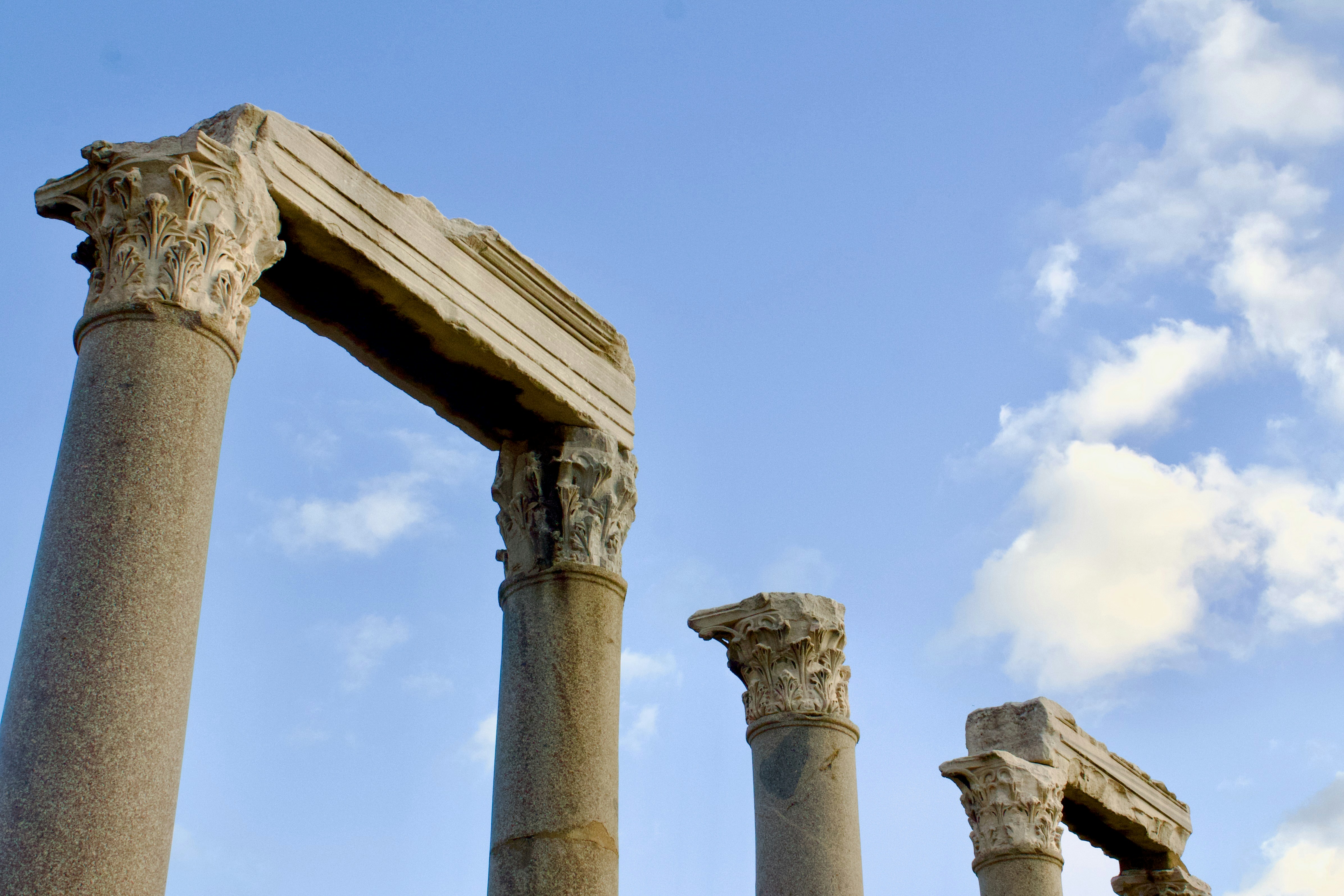 A row of ancient columns against a blue sky photo – Free İzmir Image on ...