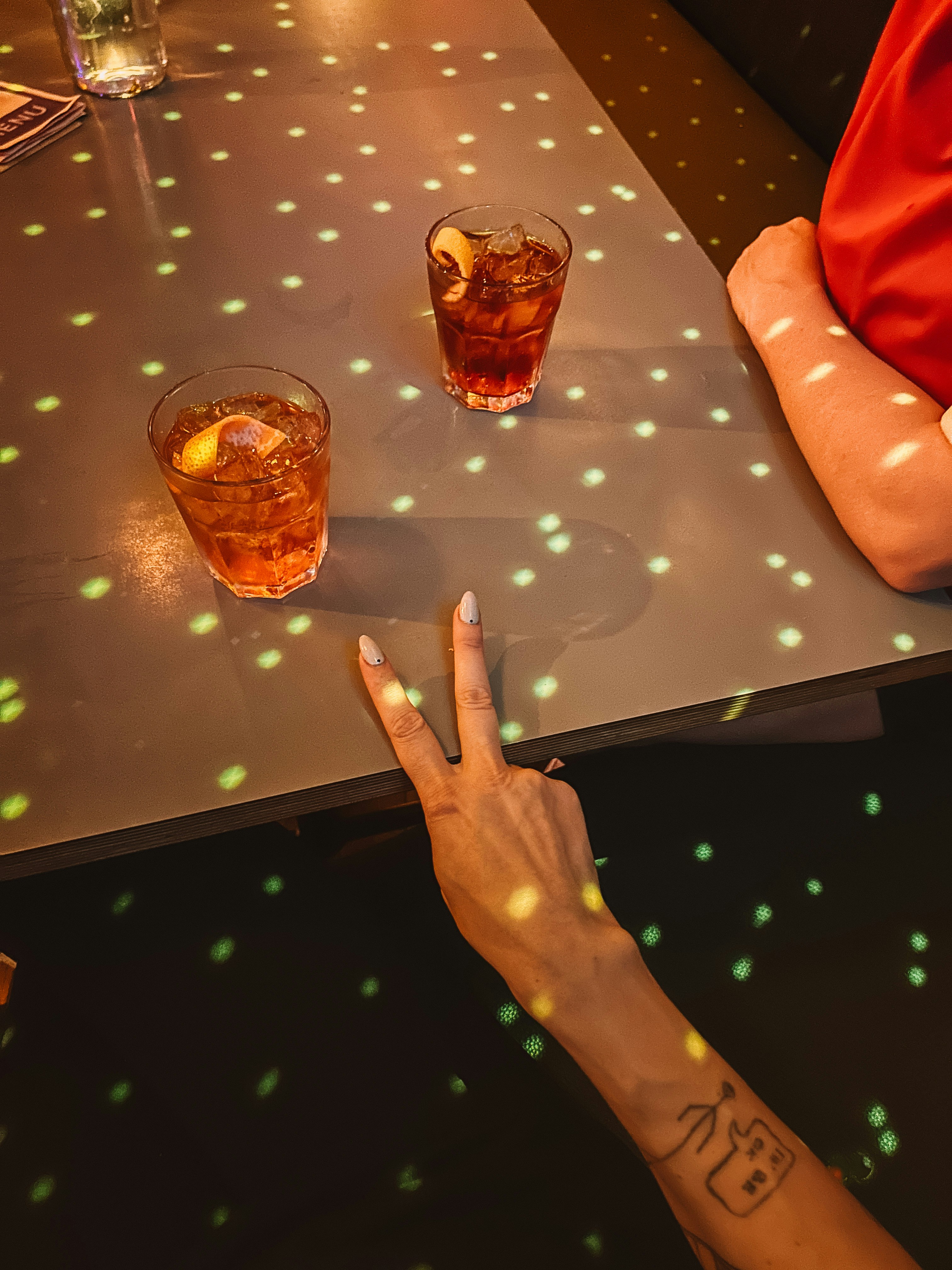 Lounge Night: Ice, Glasses, and a Lively Gesture
