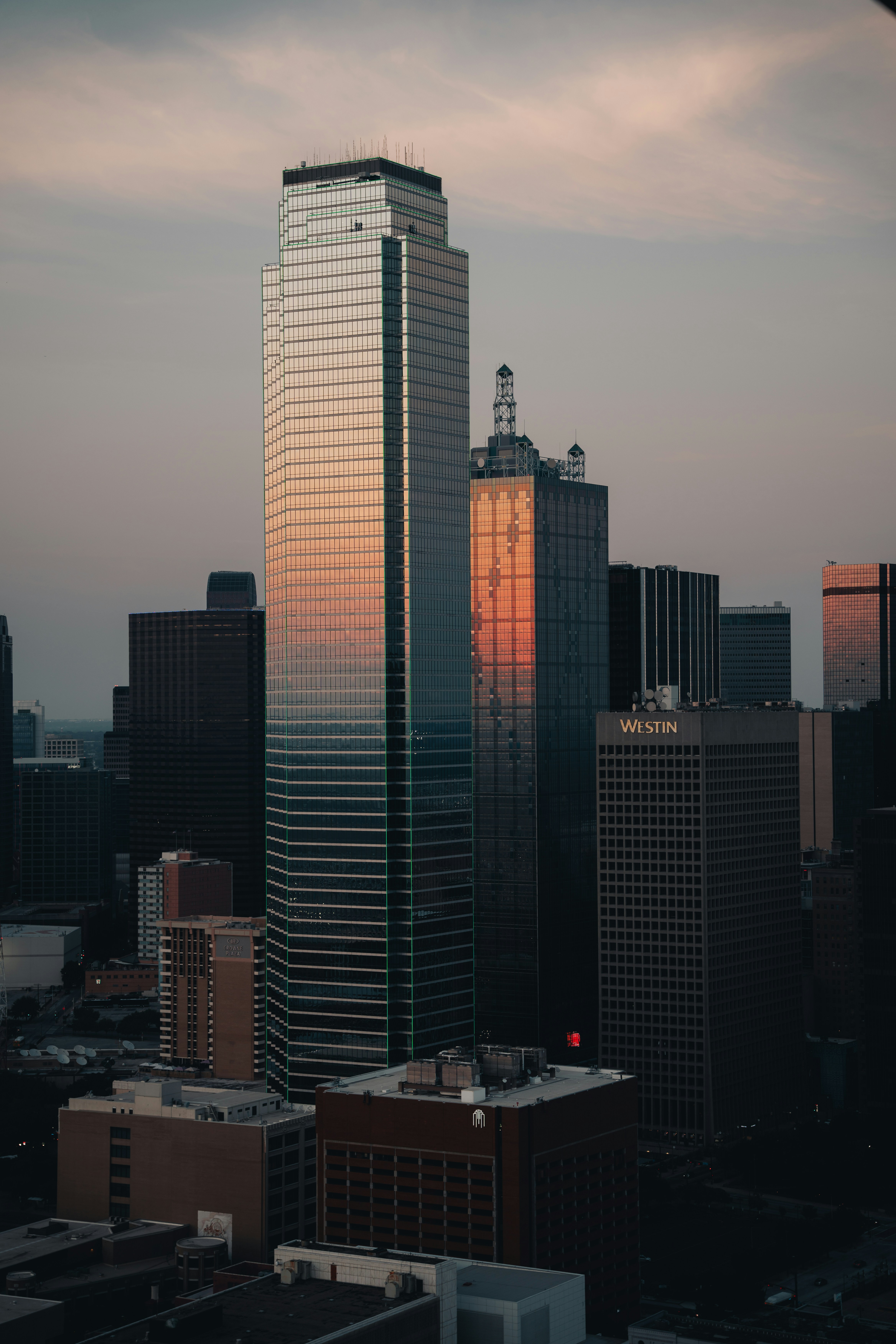 Sunset Crown on a Glass Tower: Downtown Skyline Embraced by Warm Reflections