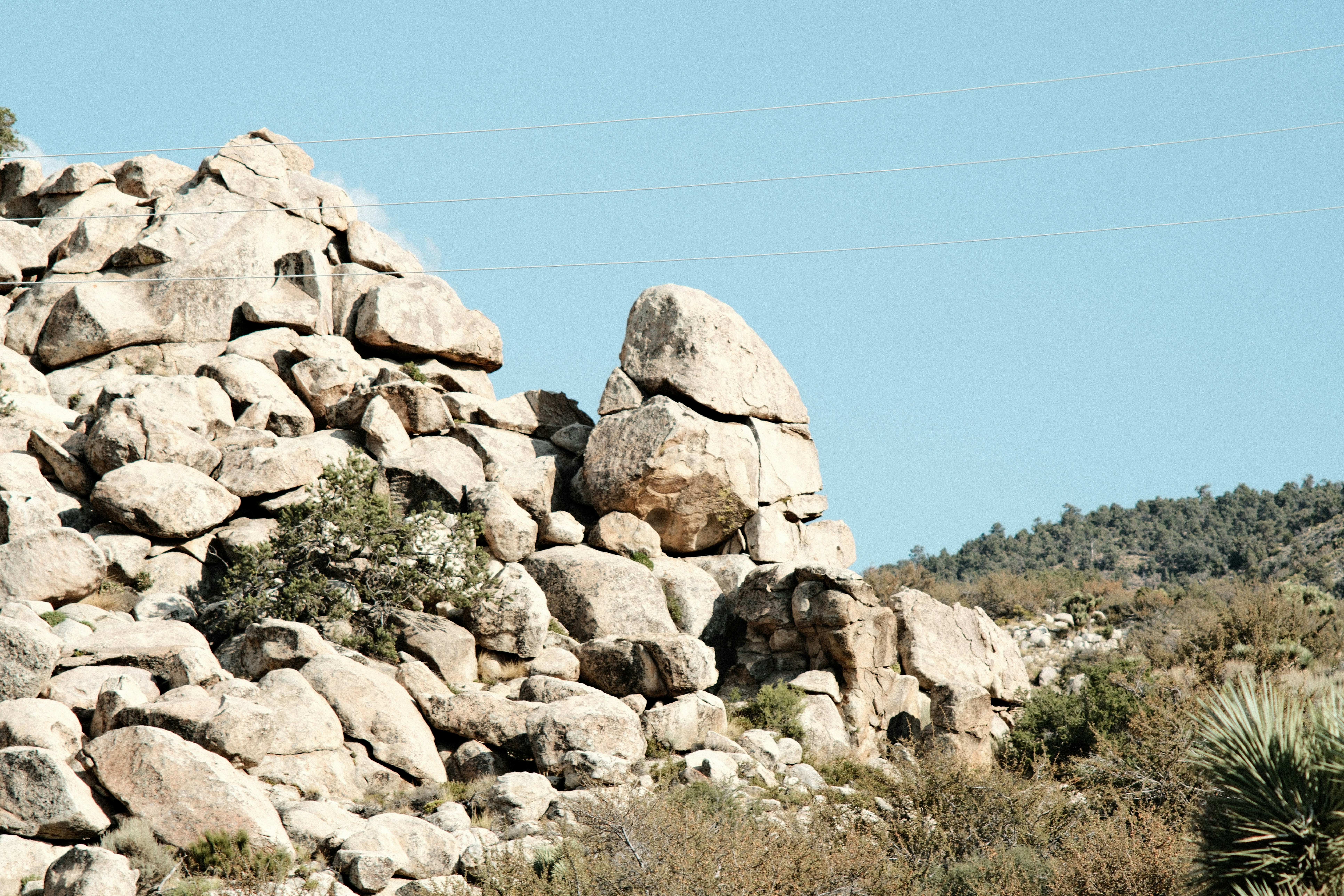A large pile of rocks sitting on top of a hill photo – Free Rock Image ...