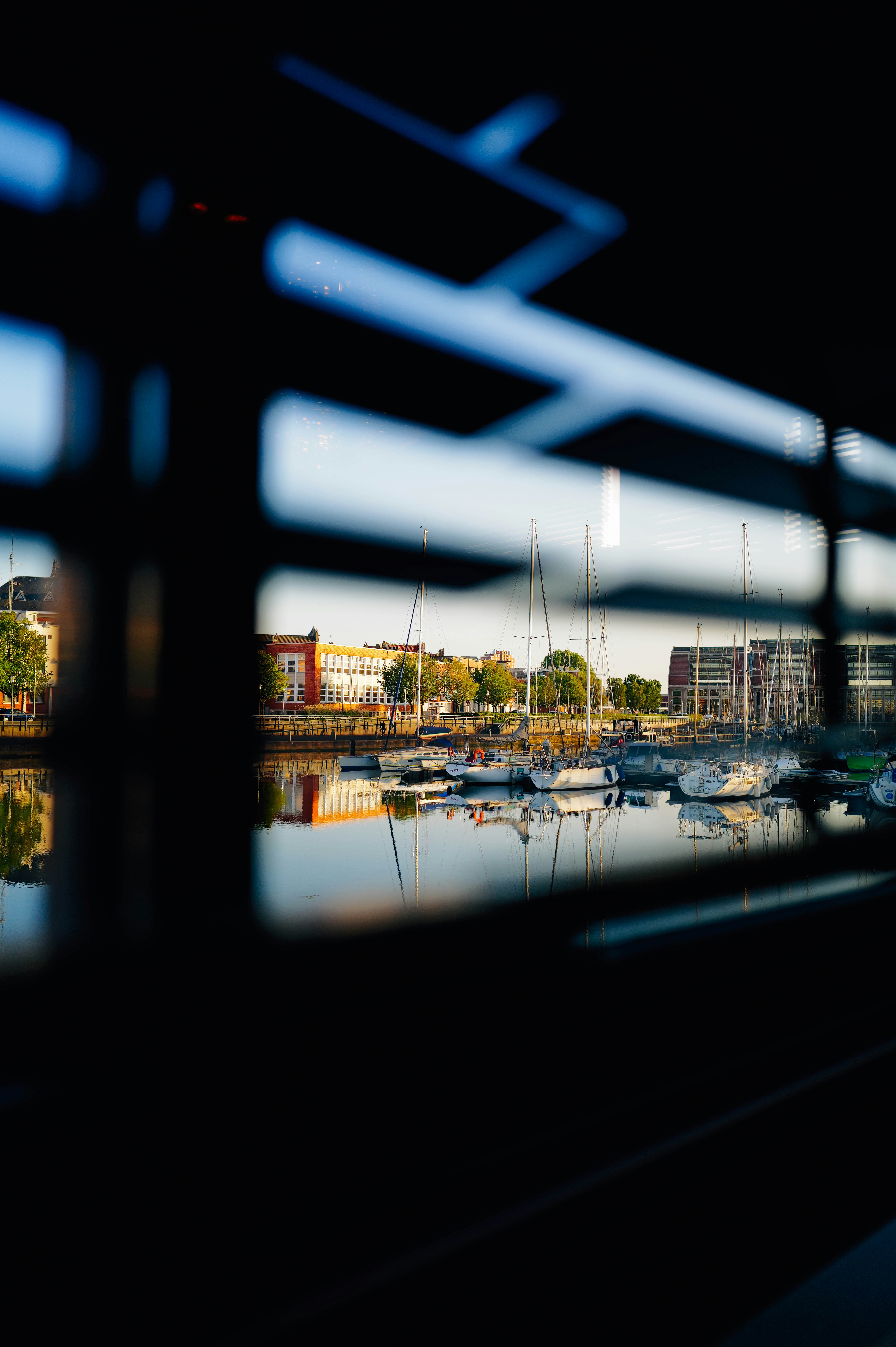 A view of a harbor from a train window photo – Free Waterfront Image on ...