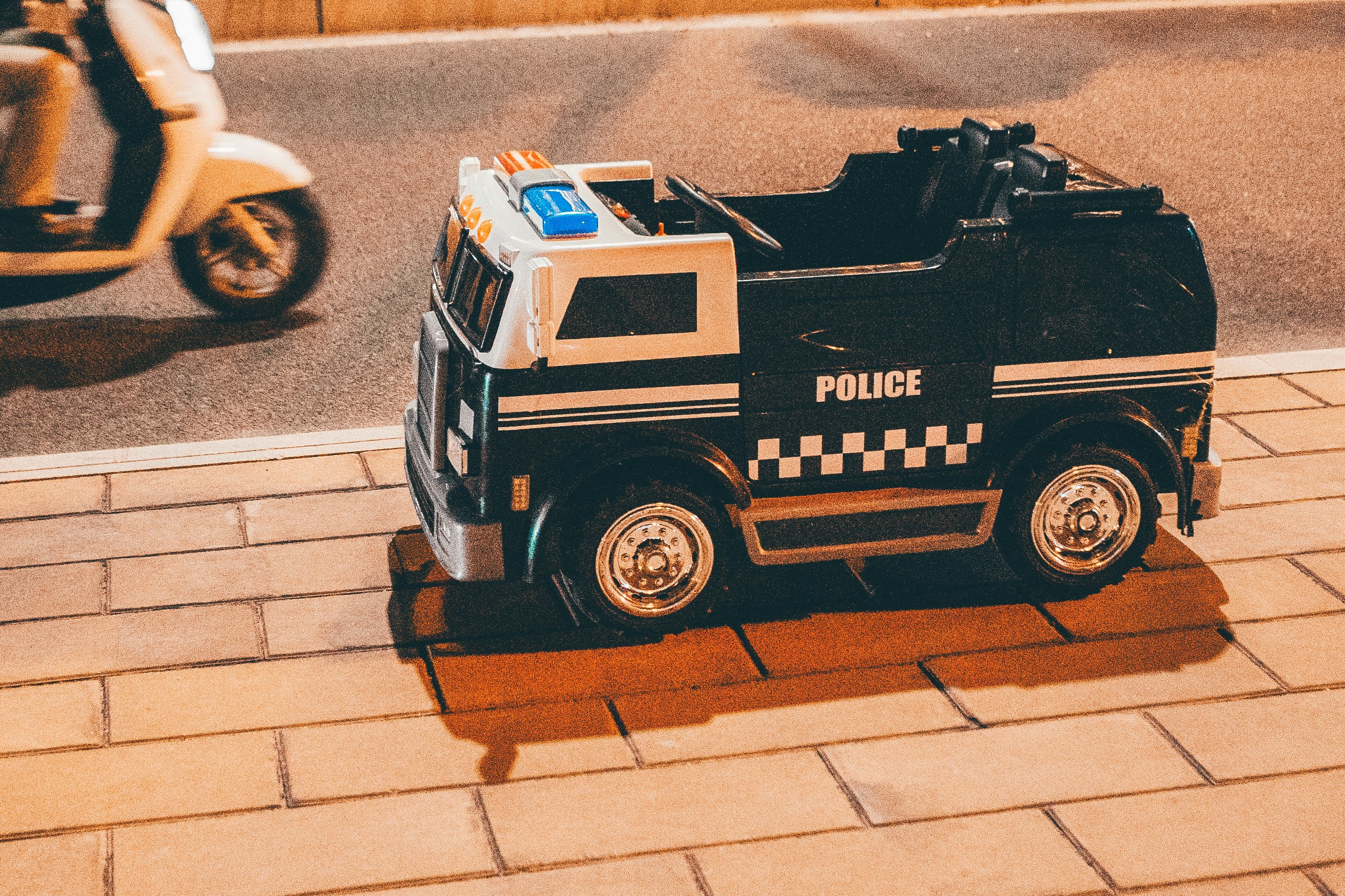 Mini Police Patrol on a Warm Sunset Walkway
