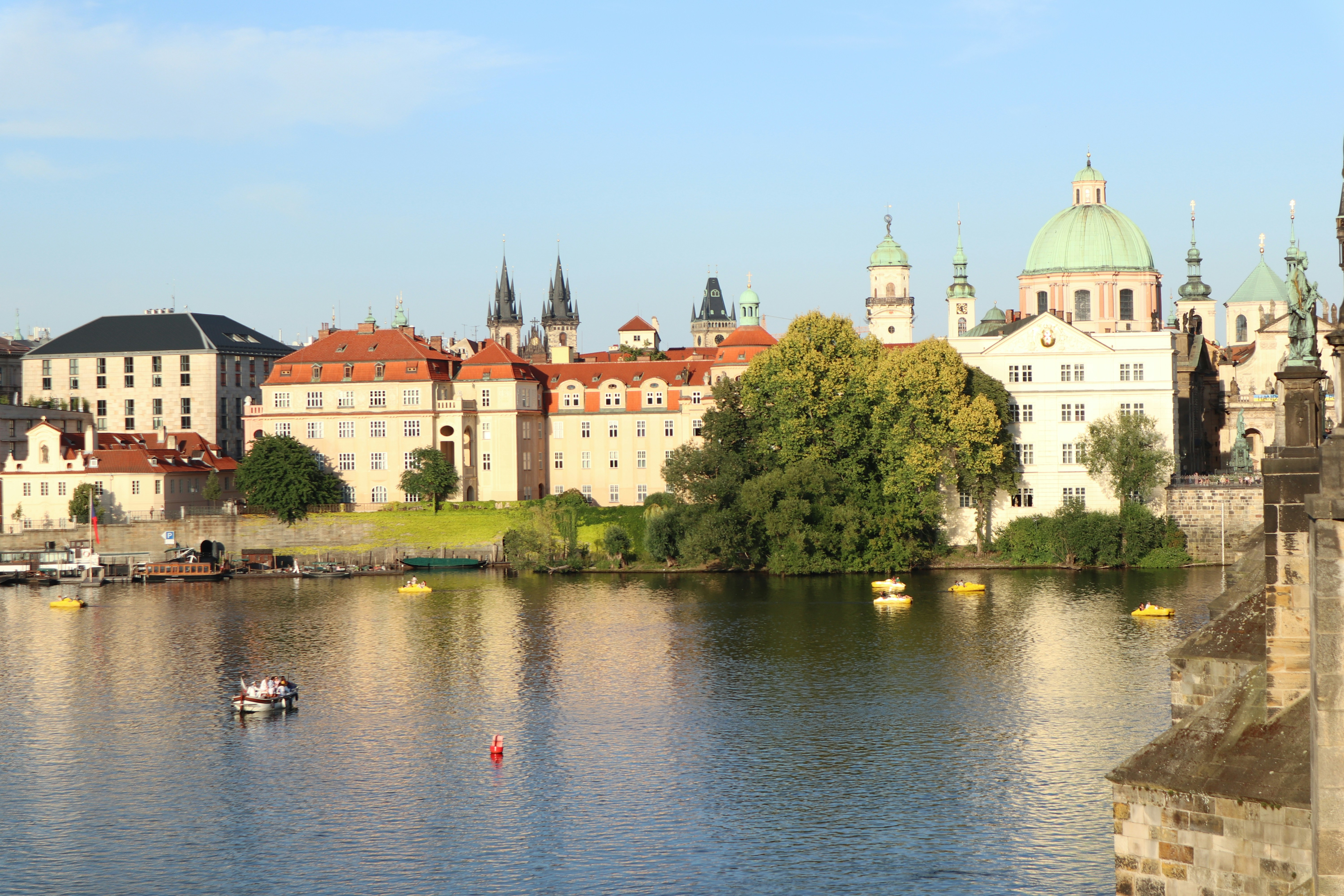 A view of a city from across a lake photo – Free Prague Image on Unsplash