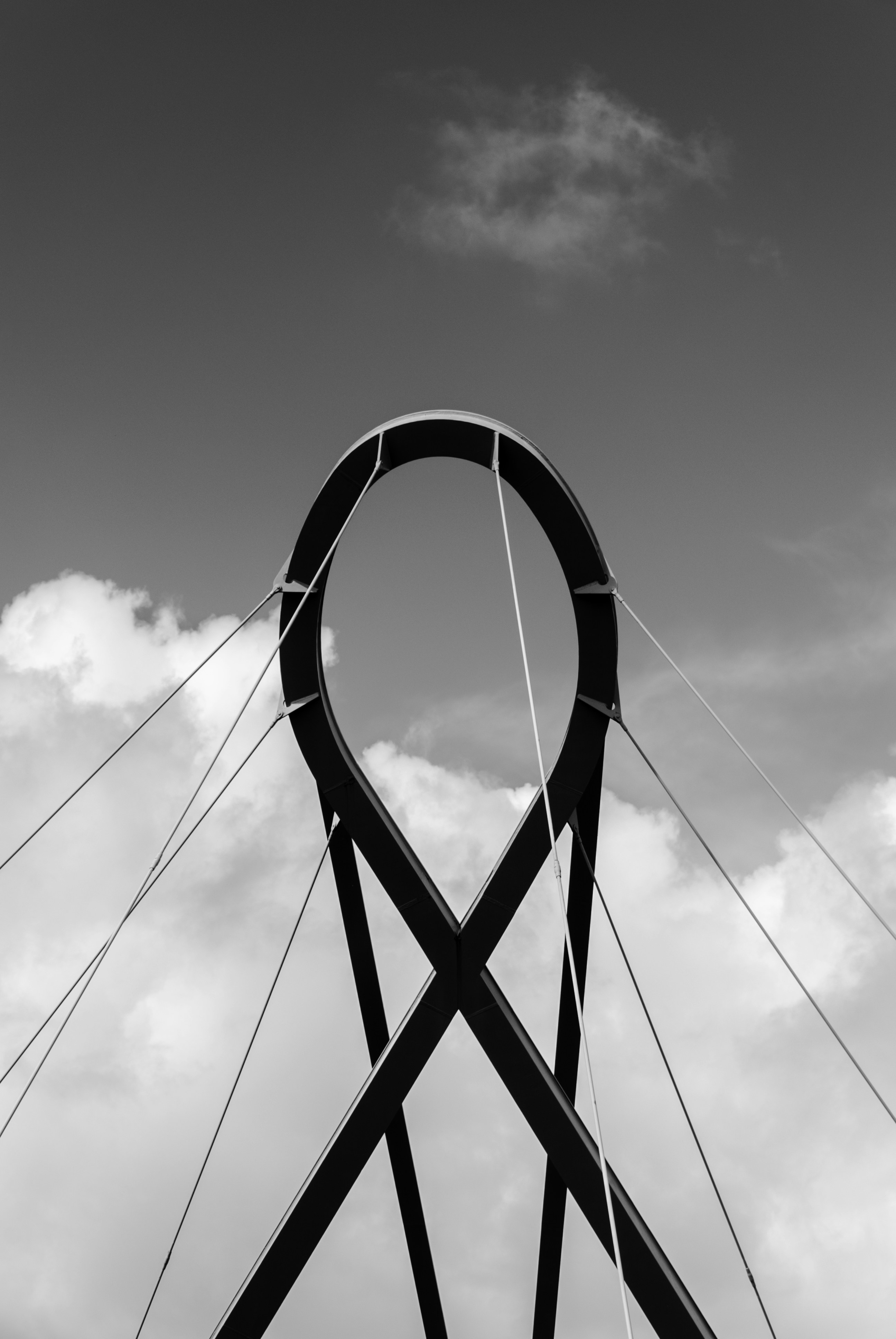 Monochrome Loop: A Steel Arc Framing the Sky