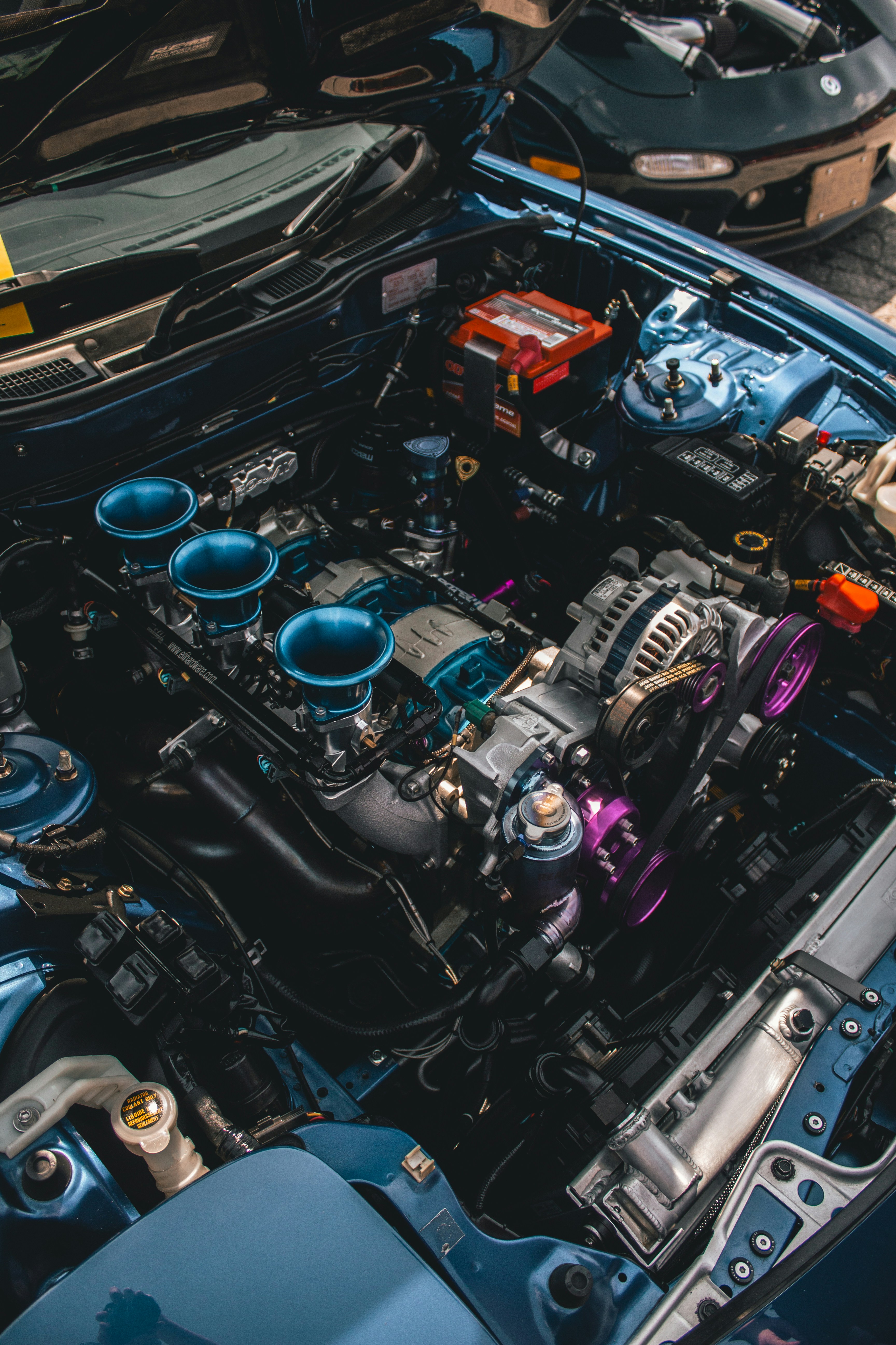 The engine of a car is shown with its hood open photo – Free Rotary ...