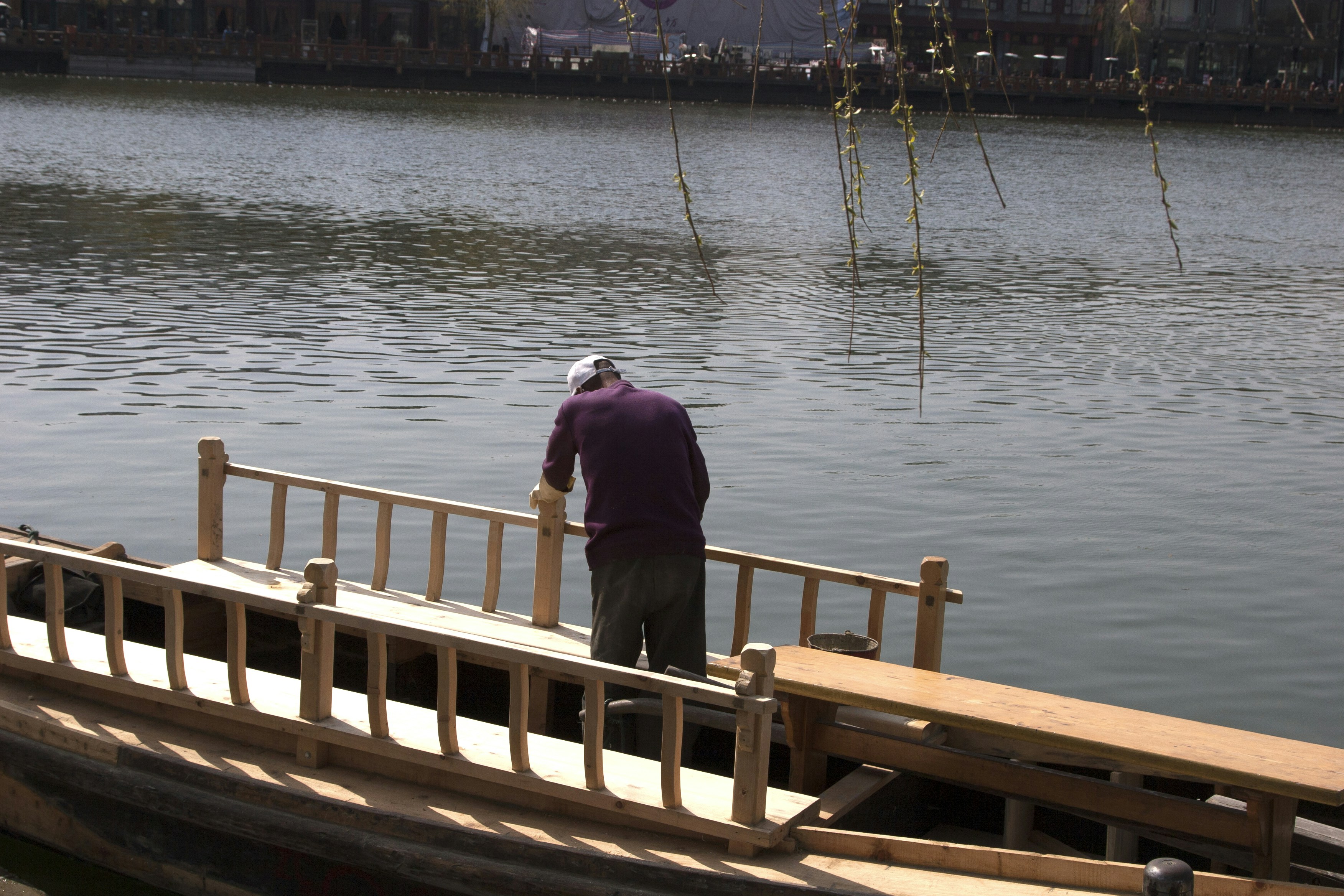 River Worker at Sunset: A Quiet Moment on the Docks