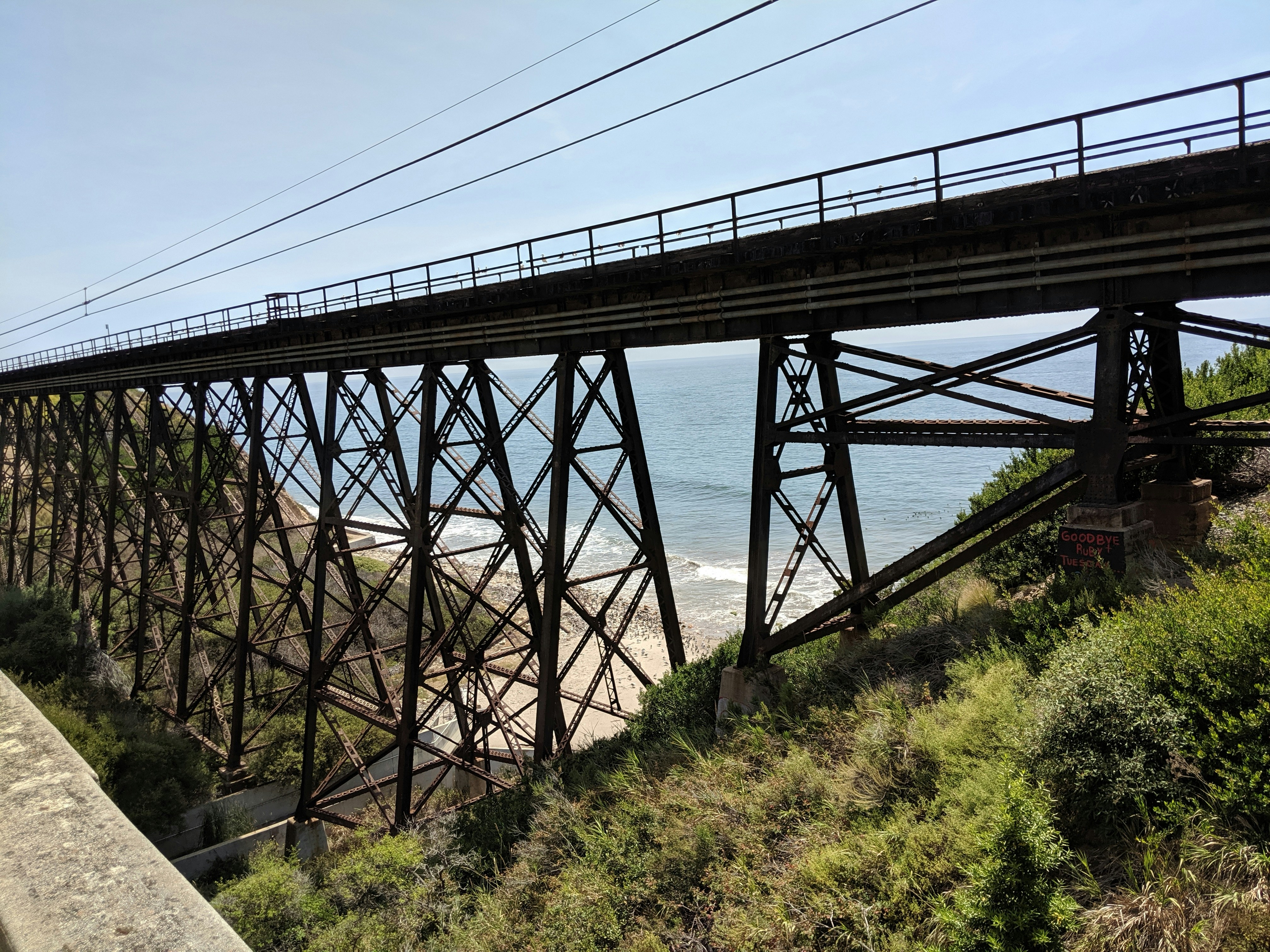 Crisscross on the Coast: A Rusted Rail Bridge Spanning the Sea