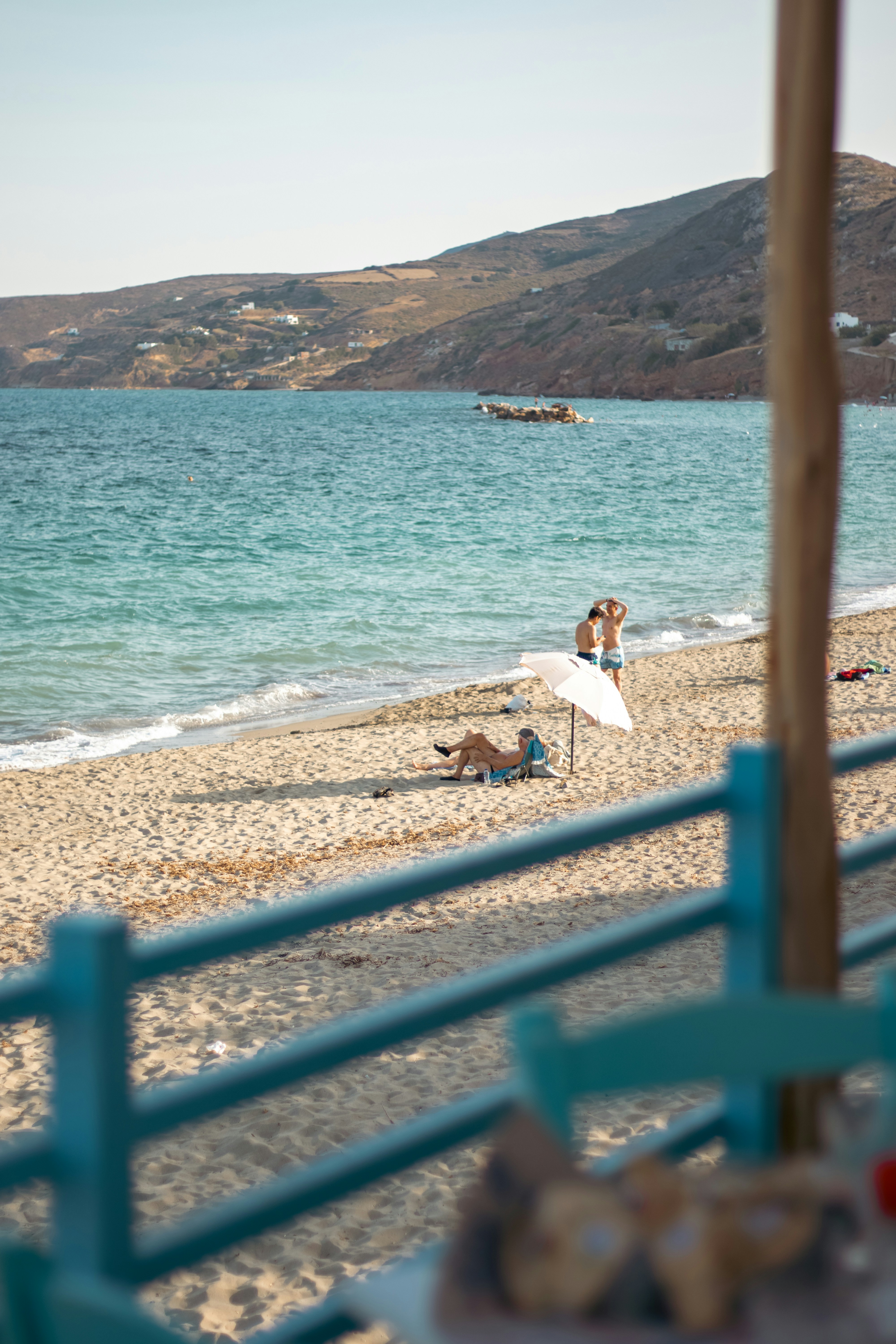 Umbrella Moment on a Turquoise Shore