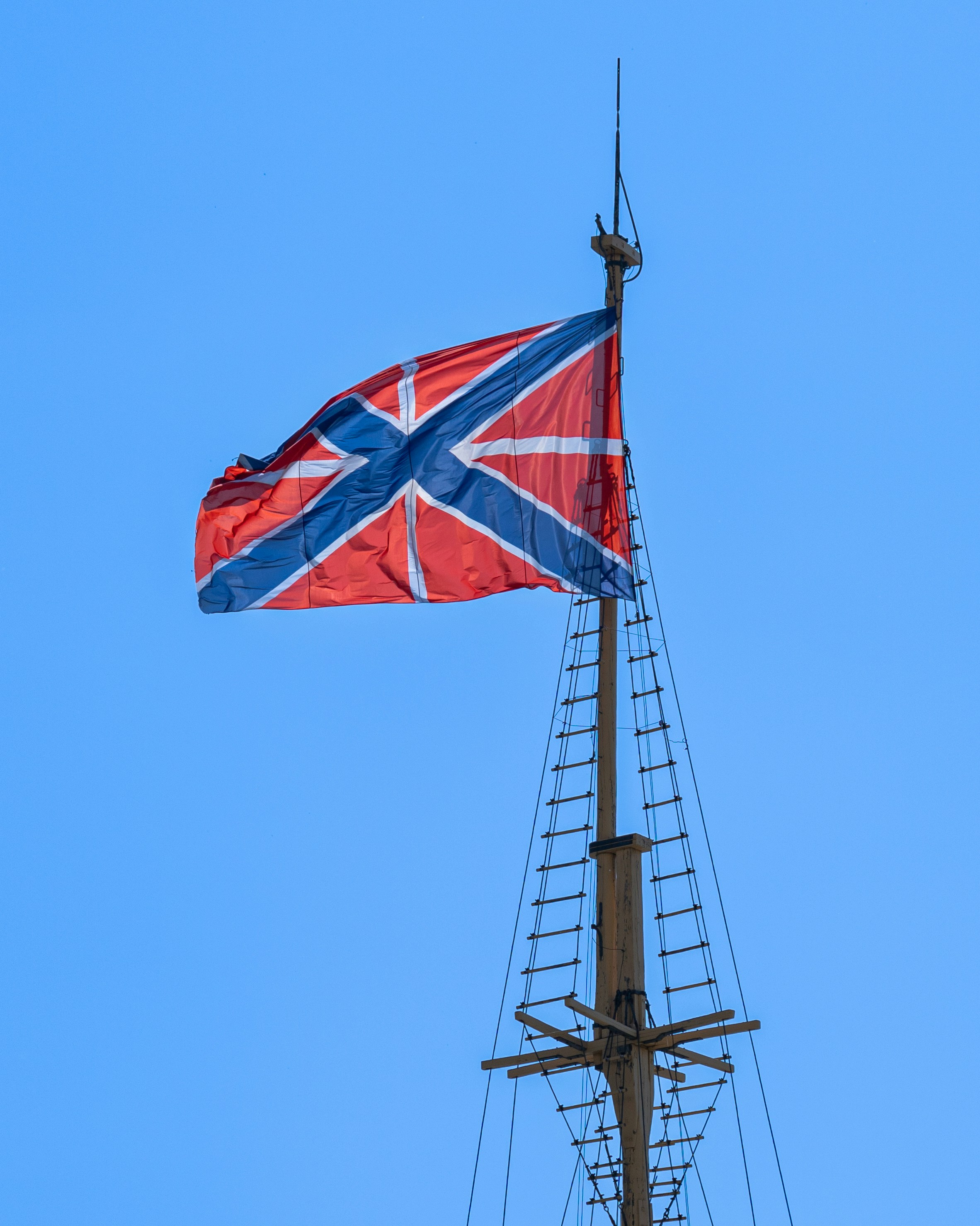 Poletop Banner: A Nordic Flag Against Clear Blue