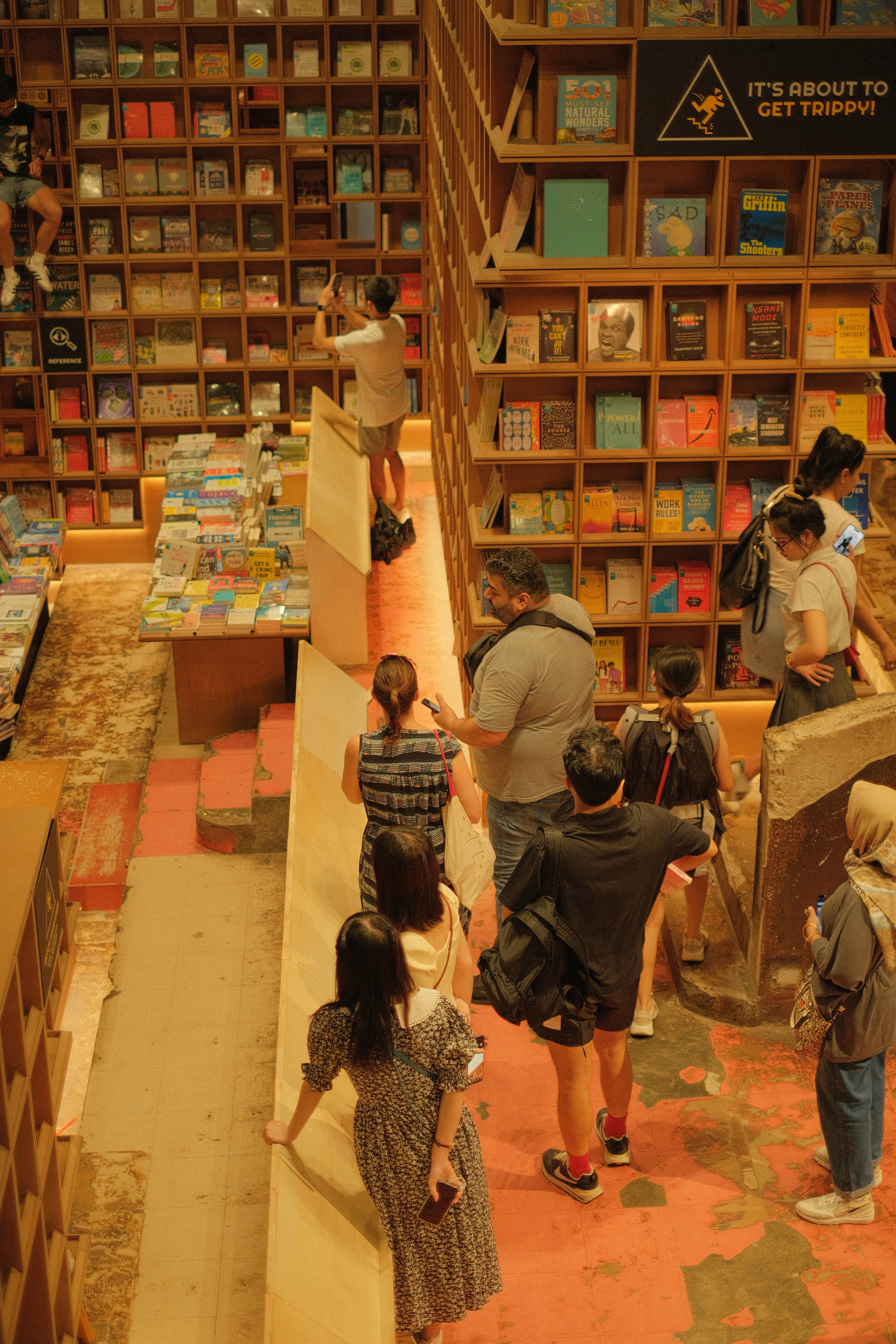 A group of people standing around a book store photo – Free Rexkl Image ...