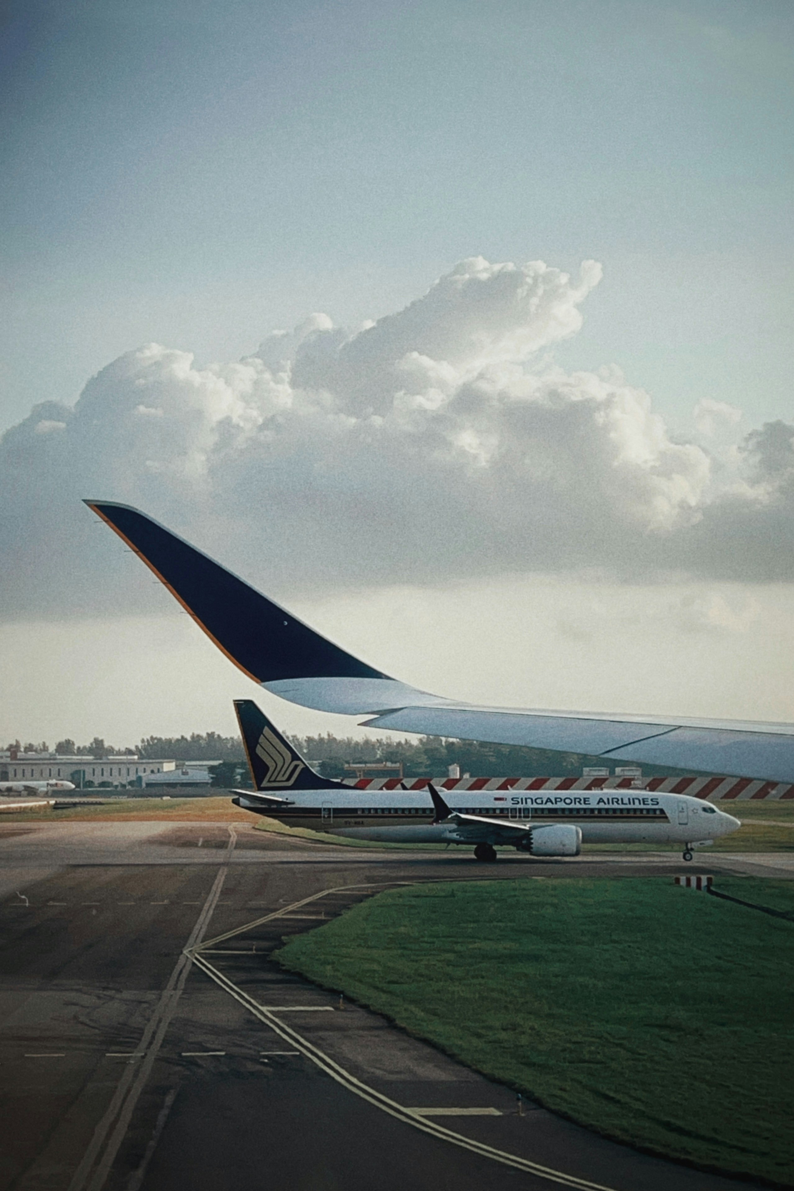 A large jetliner sitting on top of an airport runway photo – Free ...