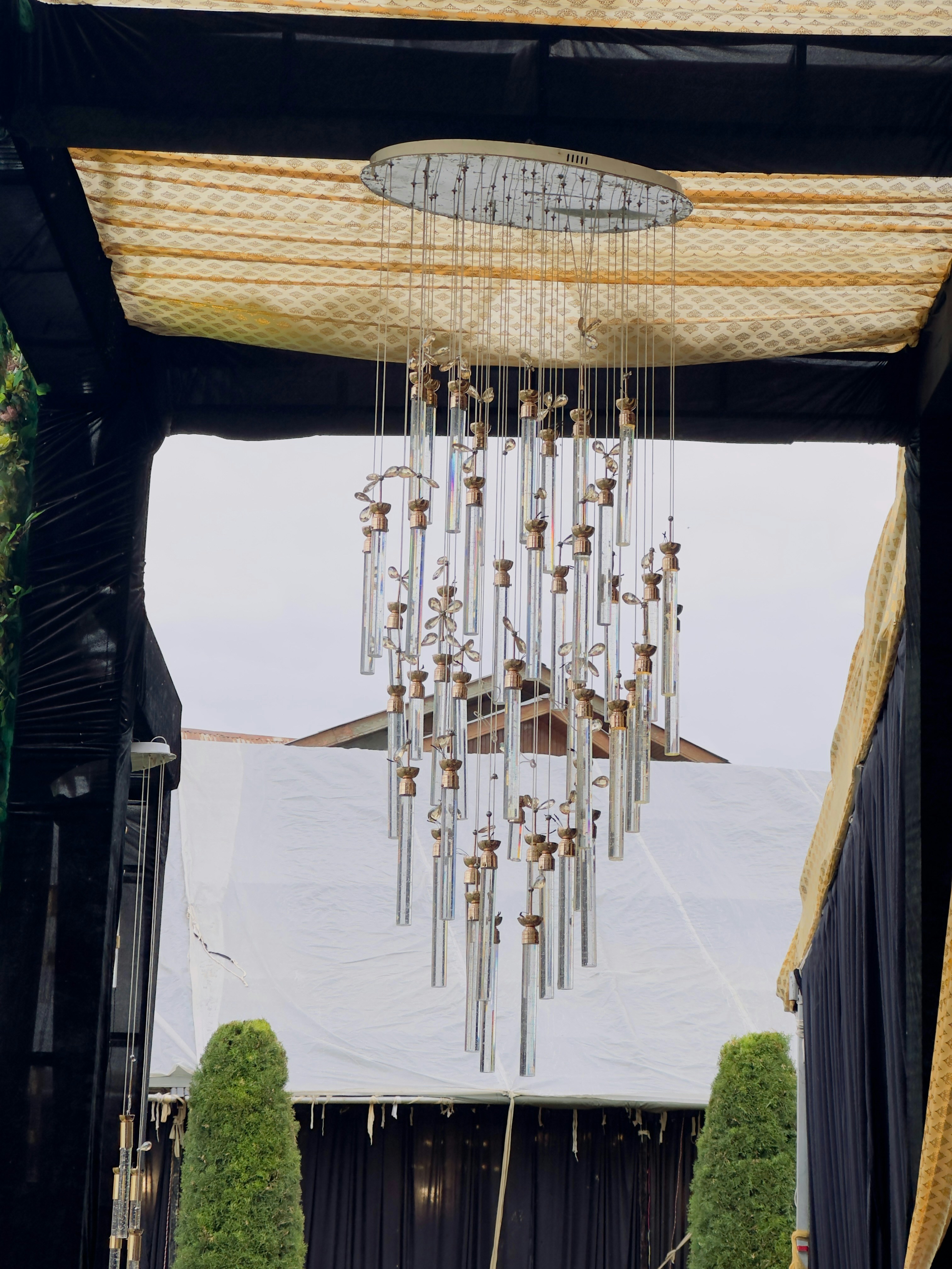 Vertical Chimes Draped in Light: An Indoor Atrium Installation