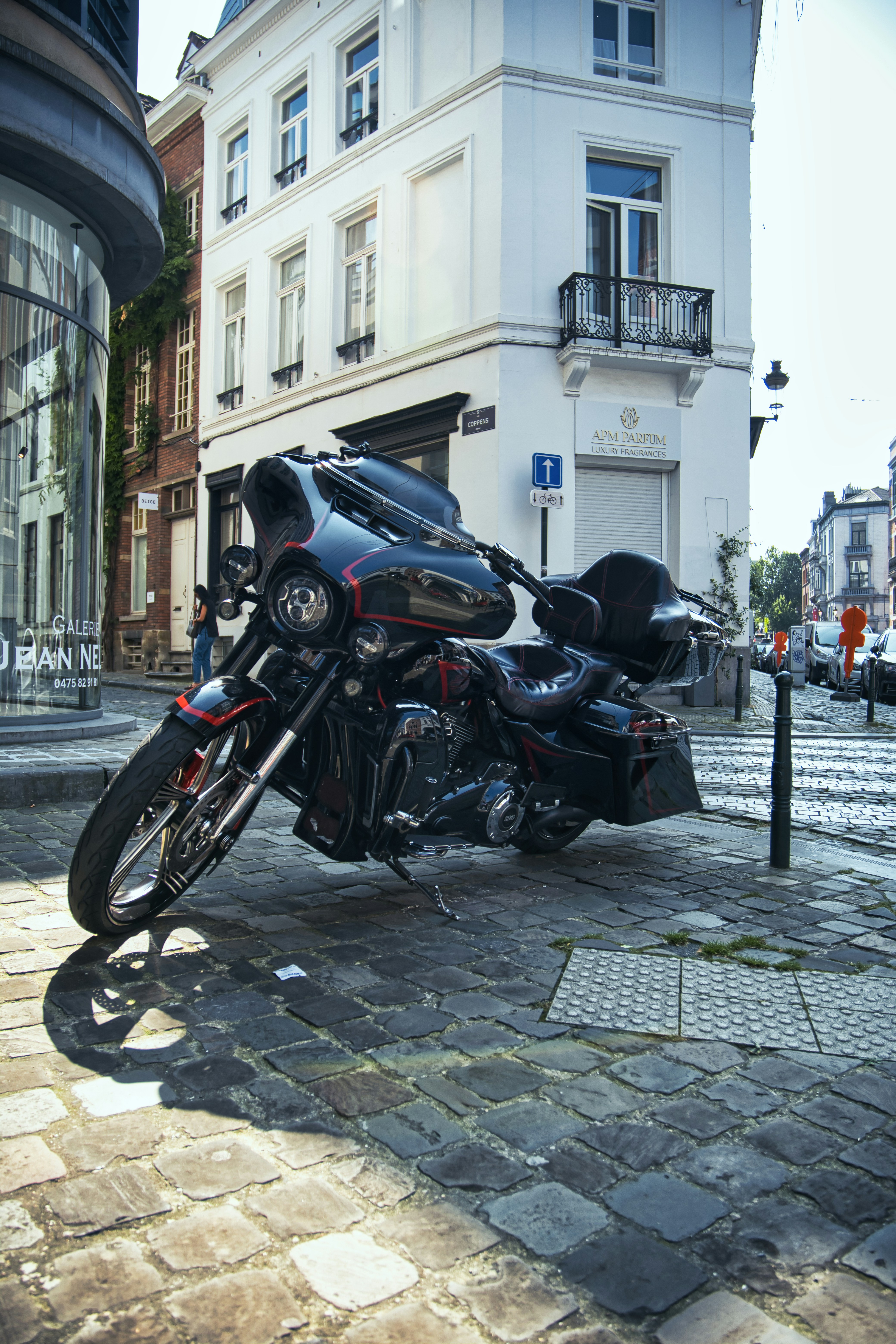 A couple of motorcycles parked next to each other photo – Free Building ...