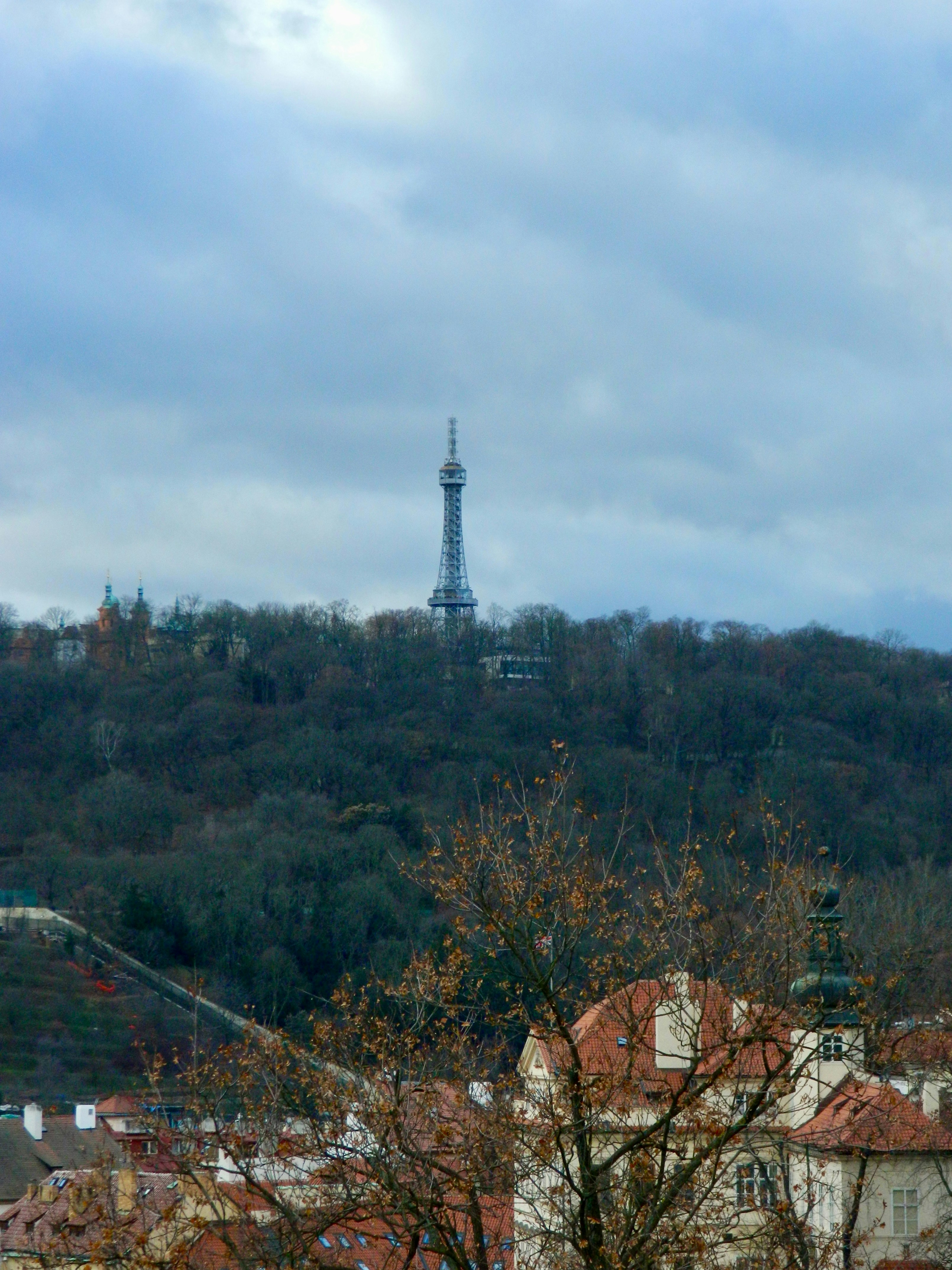 Ridge-top Broadcast Tower Over a Quiet Town