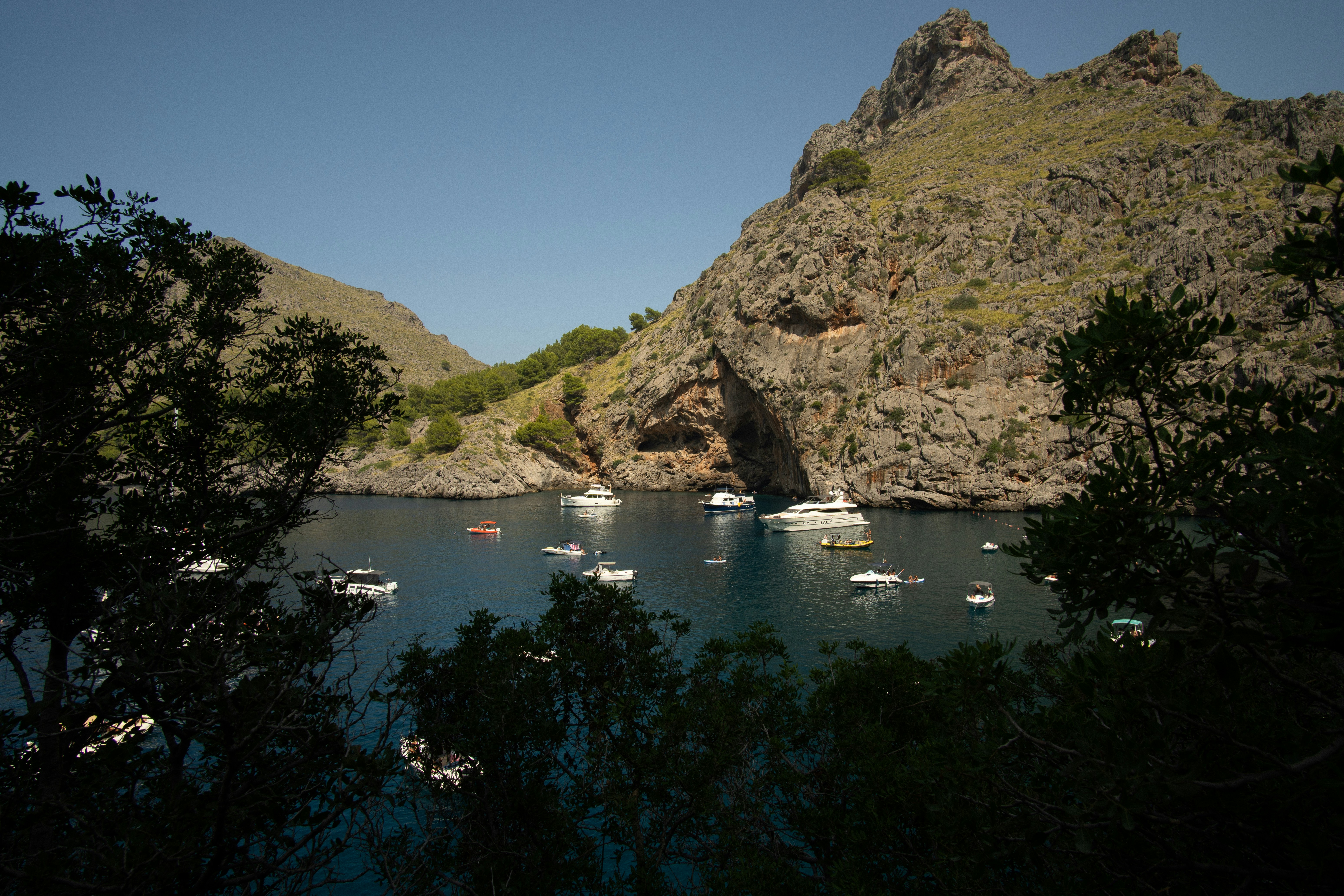 A group of boats floating on top of a body of water photo – Free ...