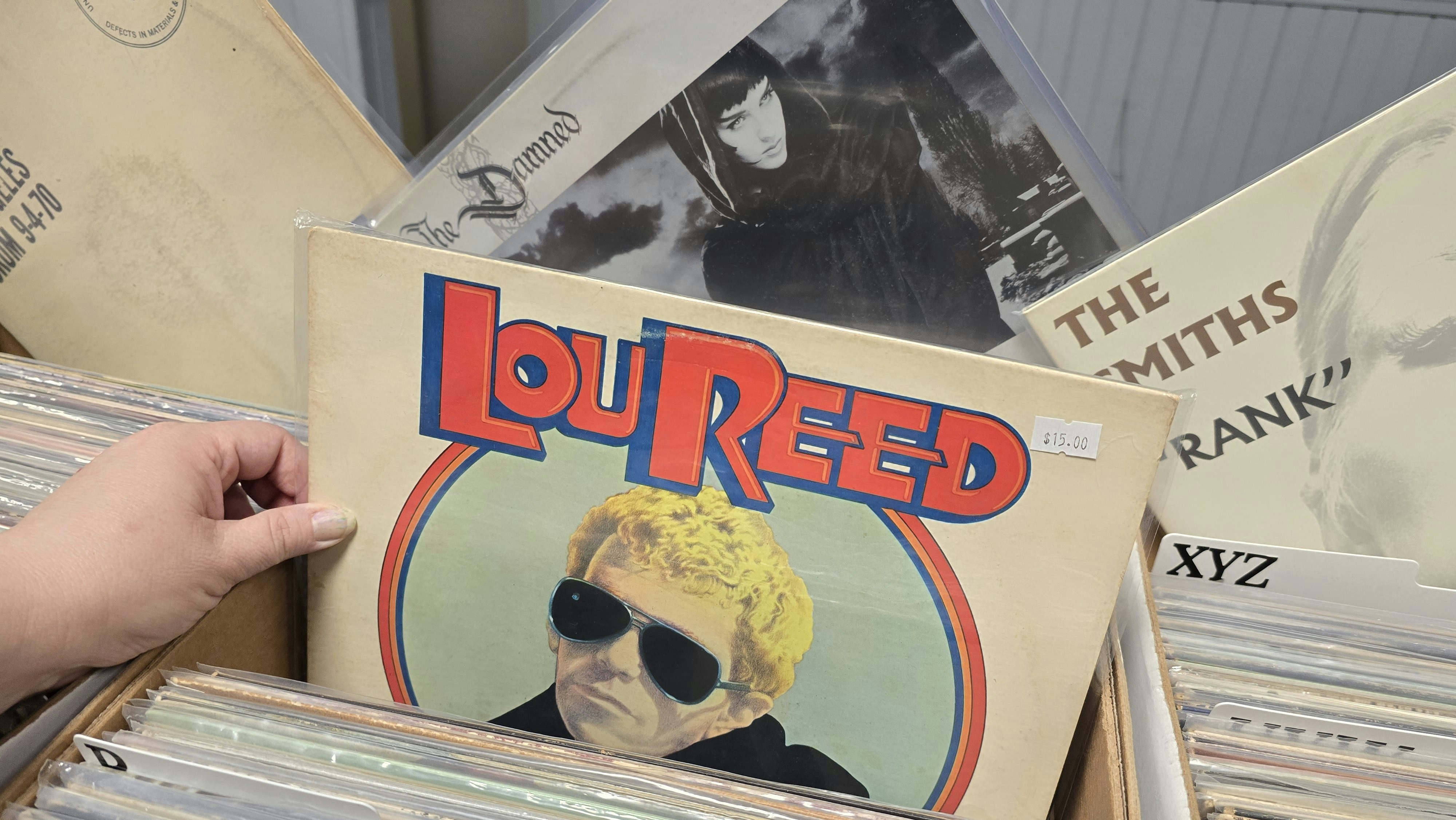 Lou Reed Vinyl Amid a Stacked Sea of Album Covers