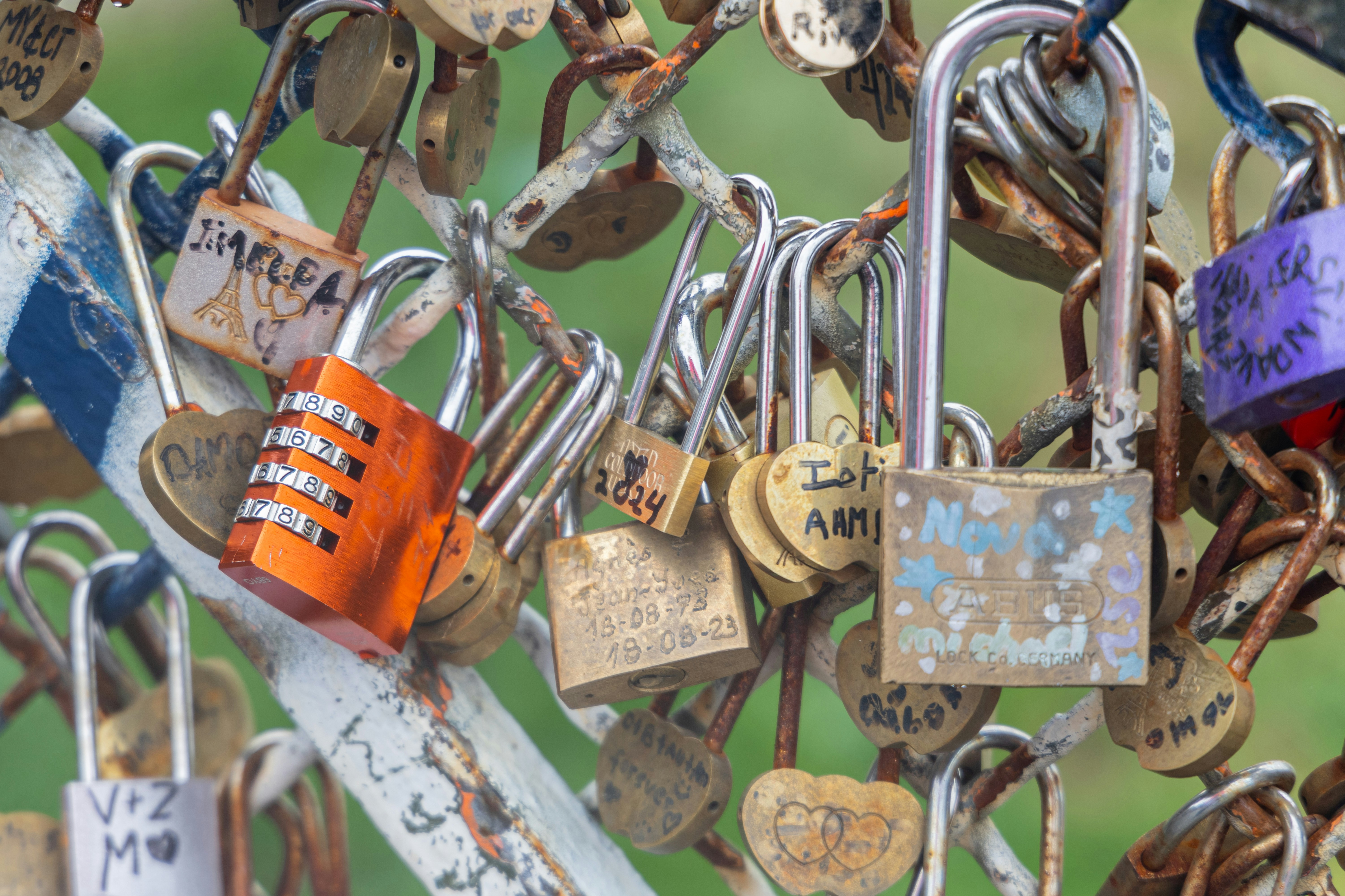 A bunch of padlocks are attached to a fence photo – Free Paris Image on ...