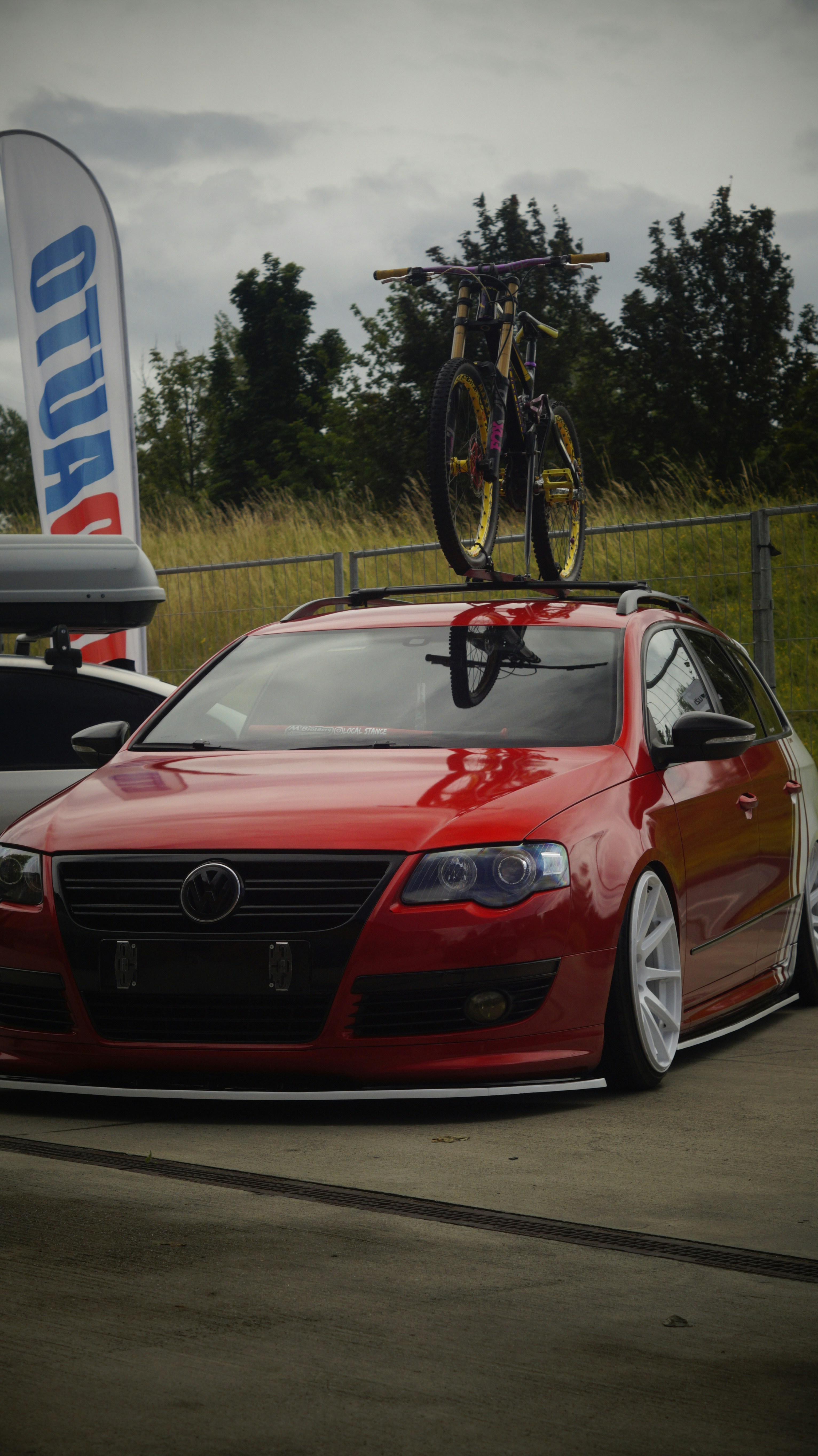 Bike on Top: A Red Car with a Stunt-Ready Mount