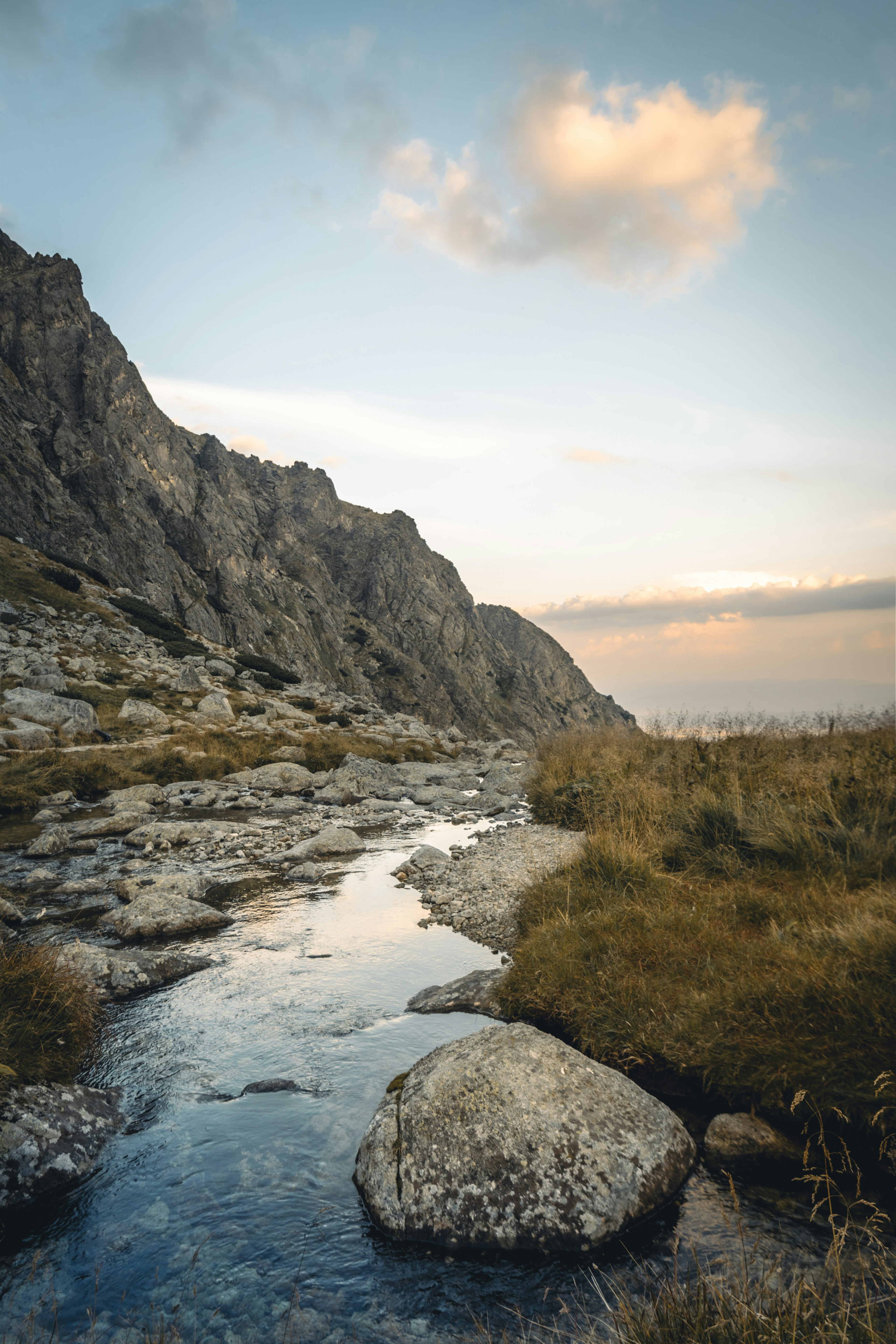 Granite Ridge, Quiet Stream: A Mountain Pass at Dusk
