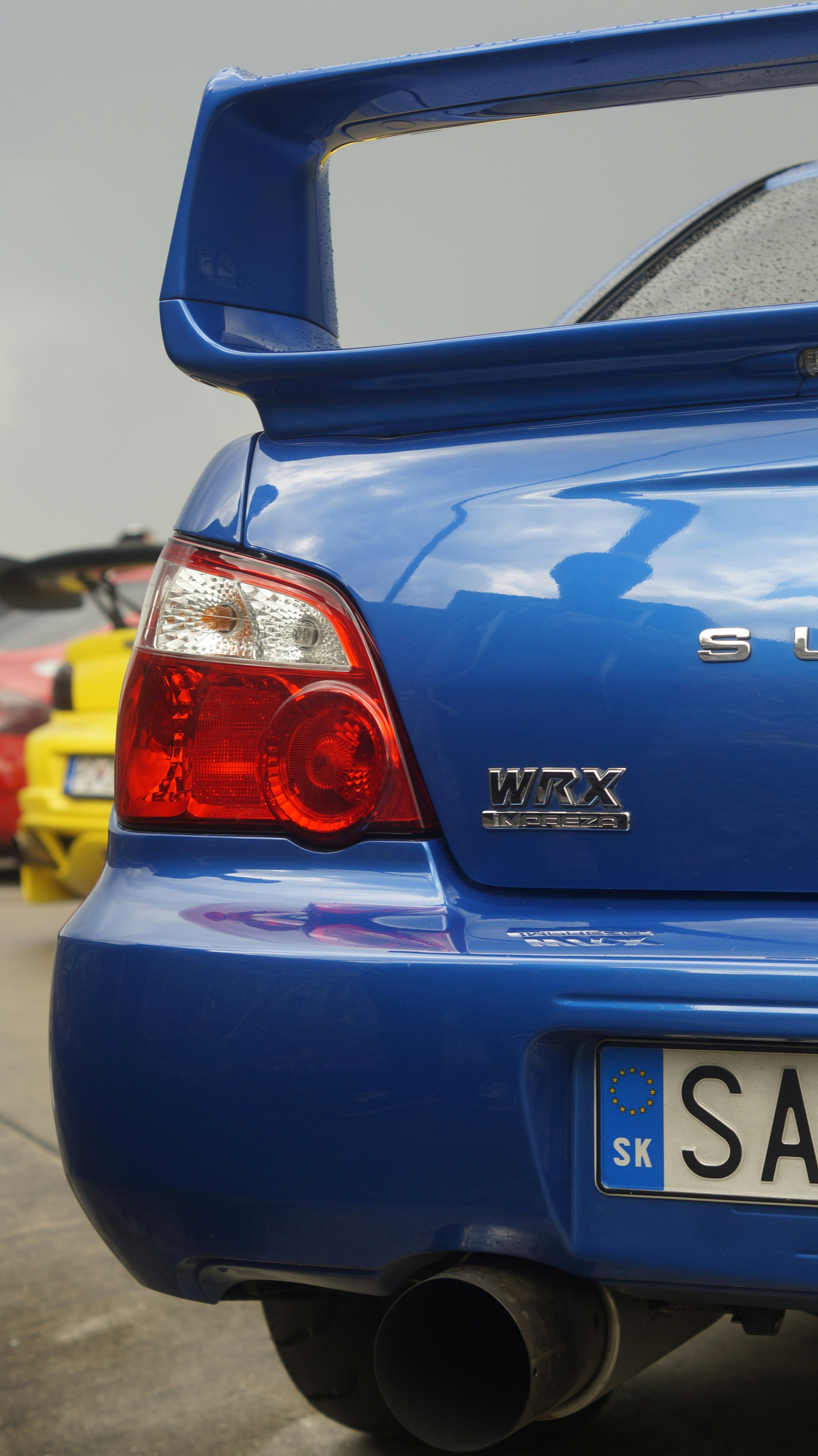 Blue WRX Rear Wing in Focus: A Parking-Lot Portrait