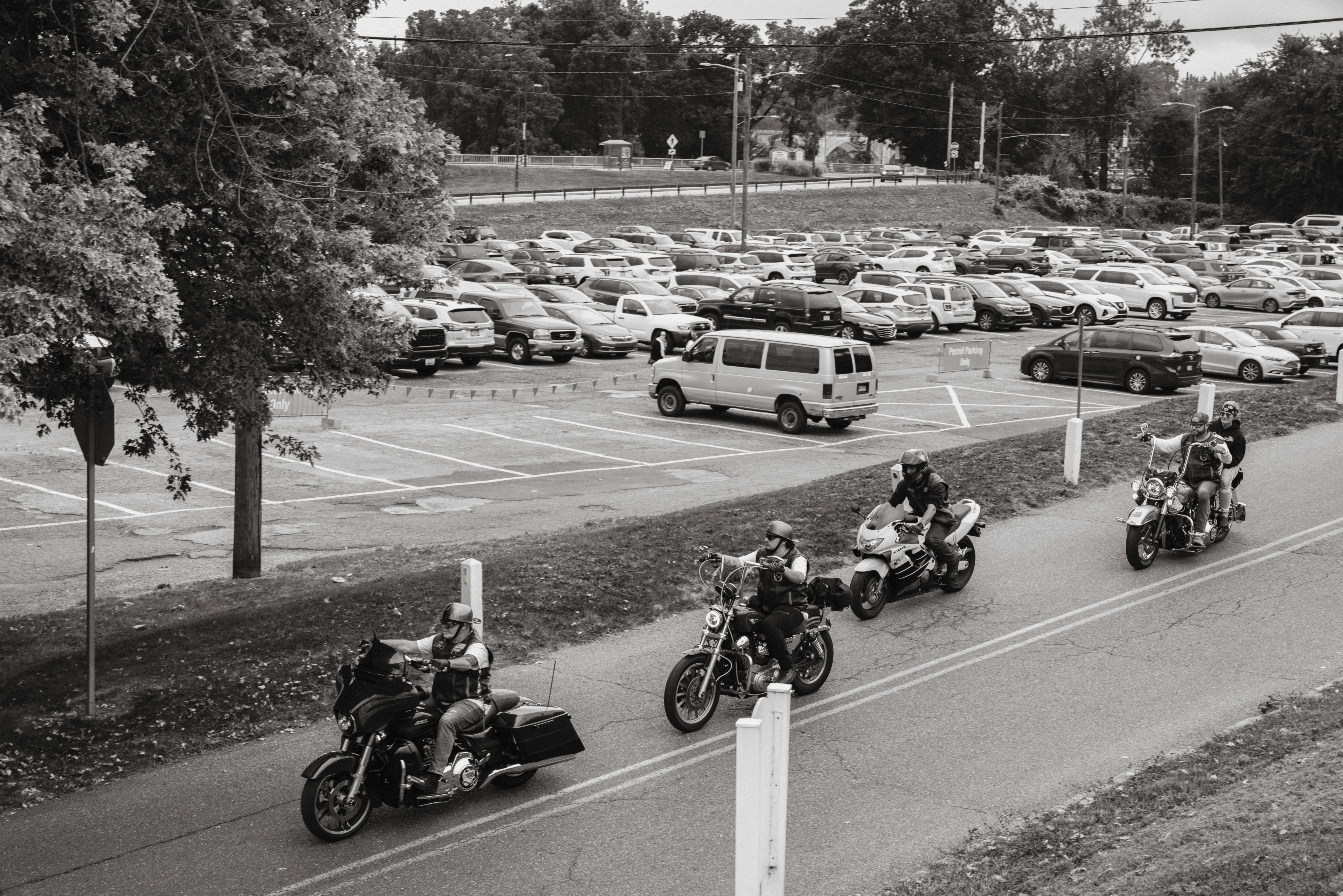 A group of people riding motorcycles down a street photo – Free Car ...