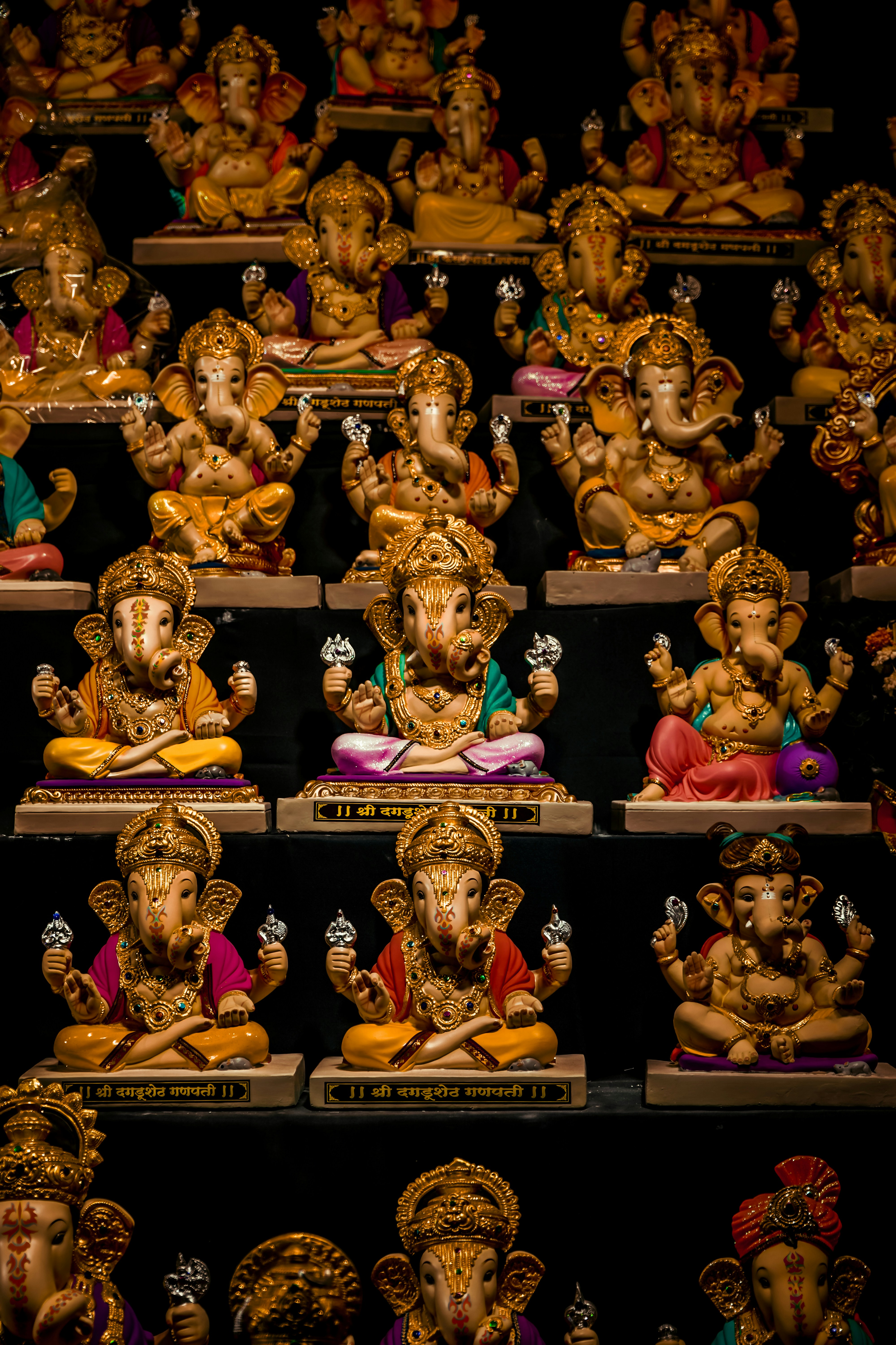 A shelf filled with lots of different types of statues photo – Free ...