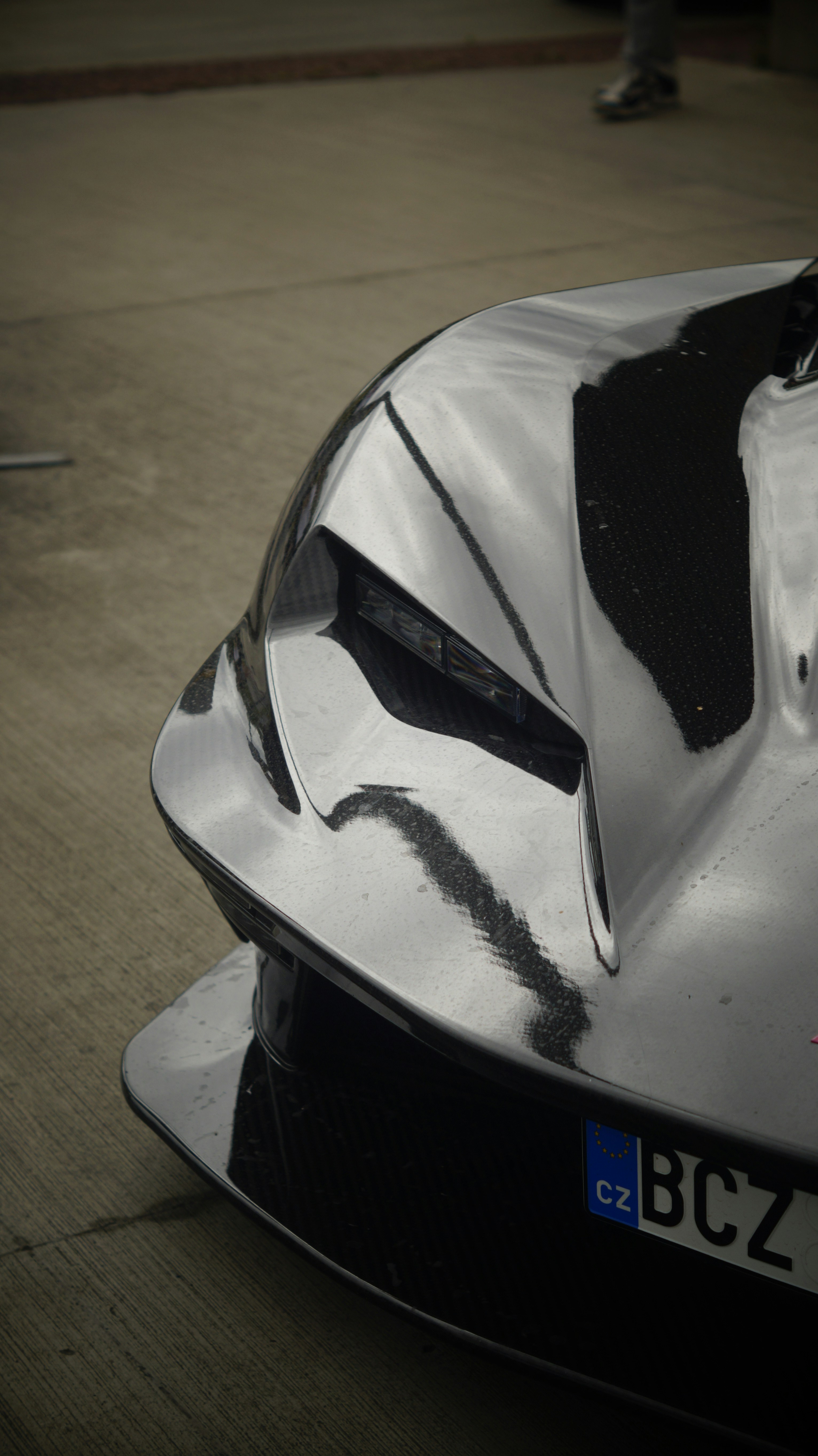 Edge of Chrome: Close-Up on a Sleek Silver Front End