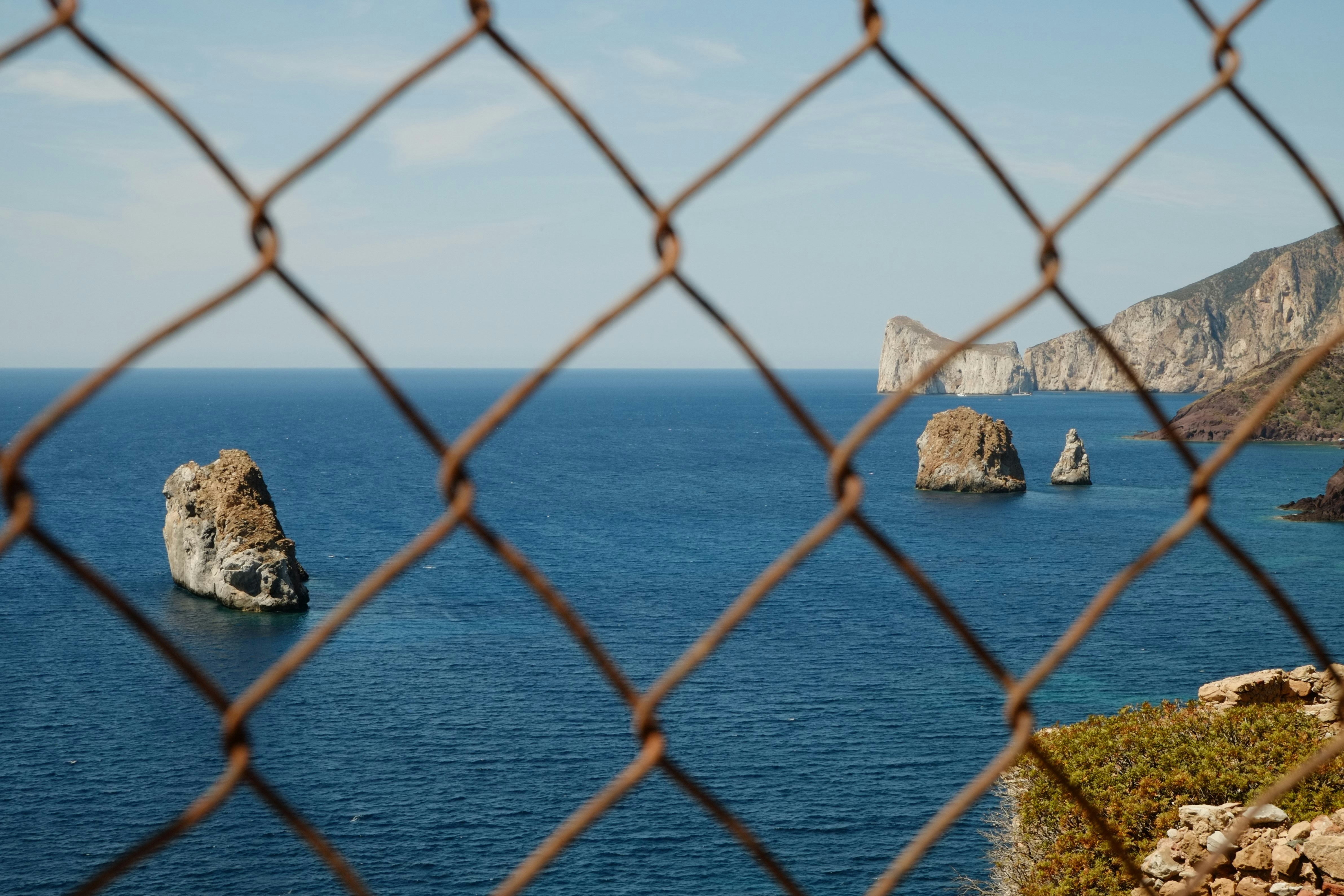 Sea Stacks Through Diamond Mesh: Quiet Atlantic Vista