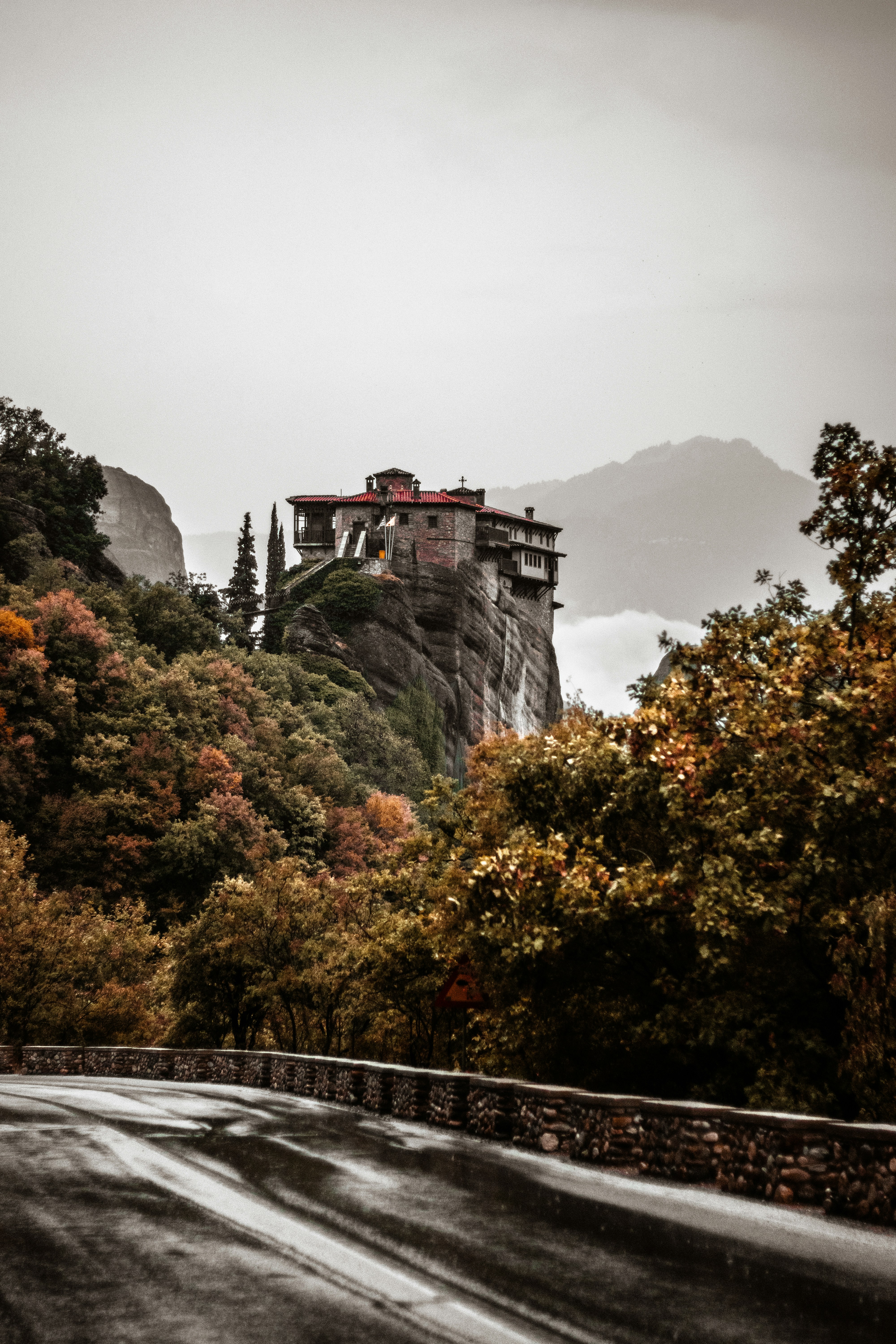 Cliffside Monastery in Autumn Mist