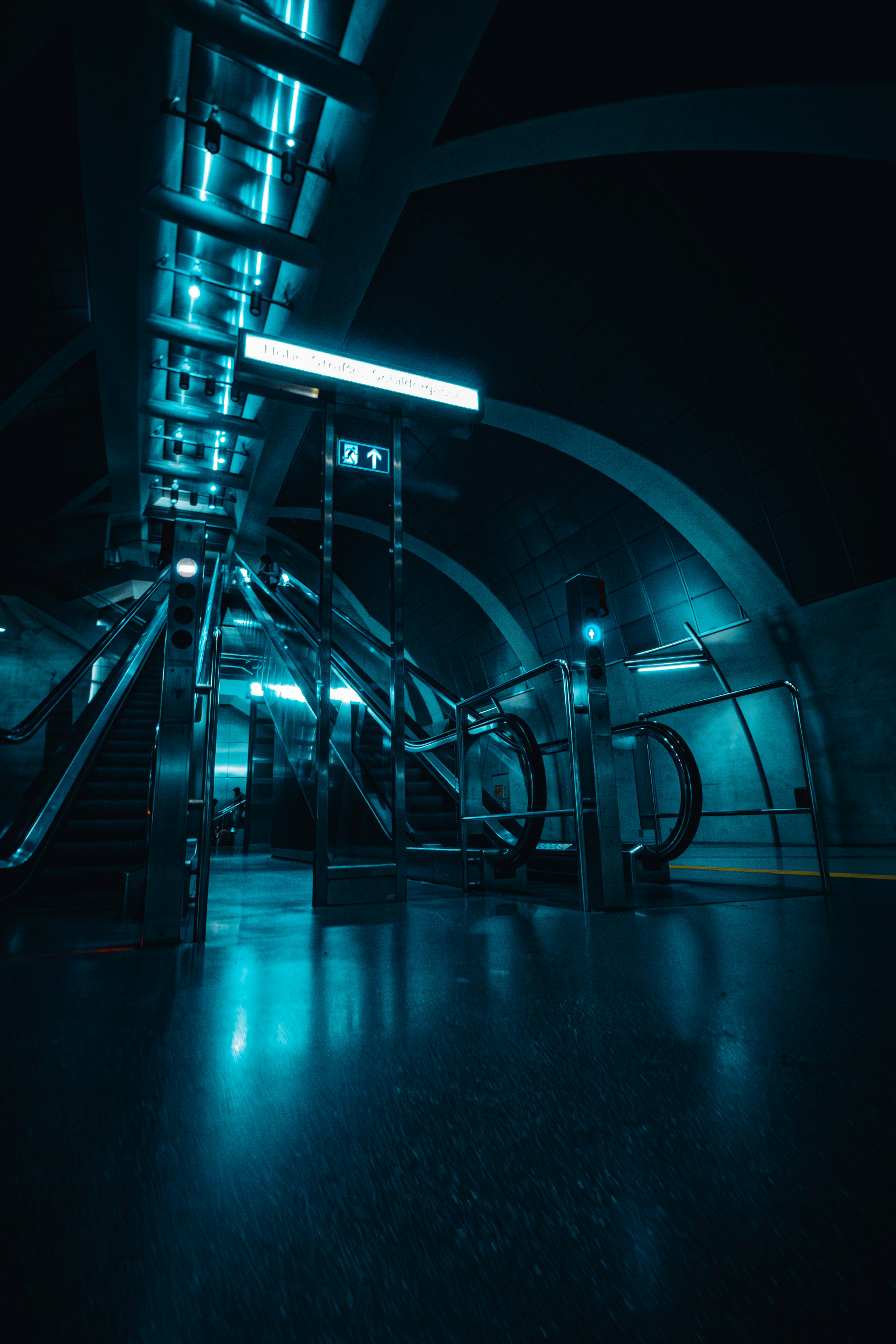 An empty subway station with blue lights at night photo – Free Building ...