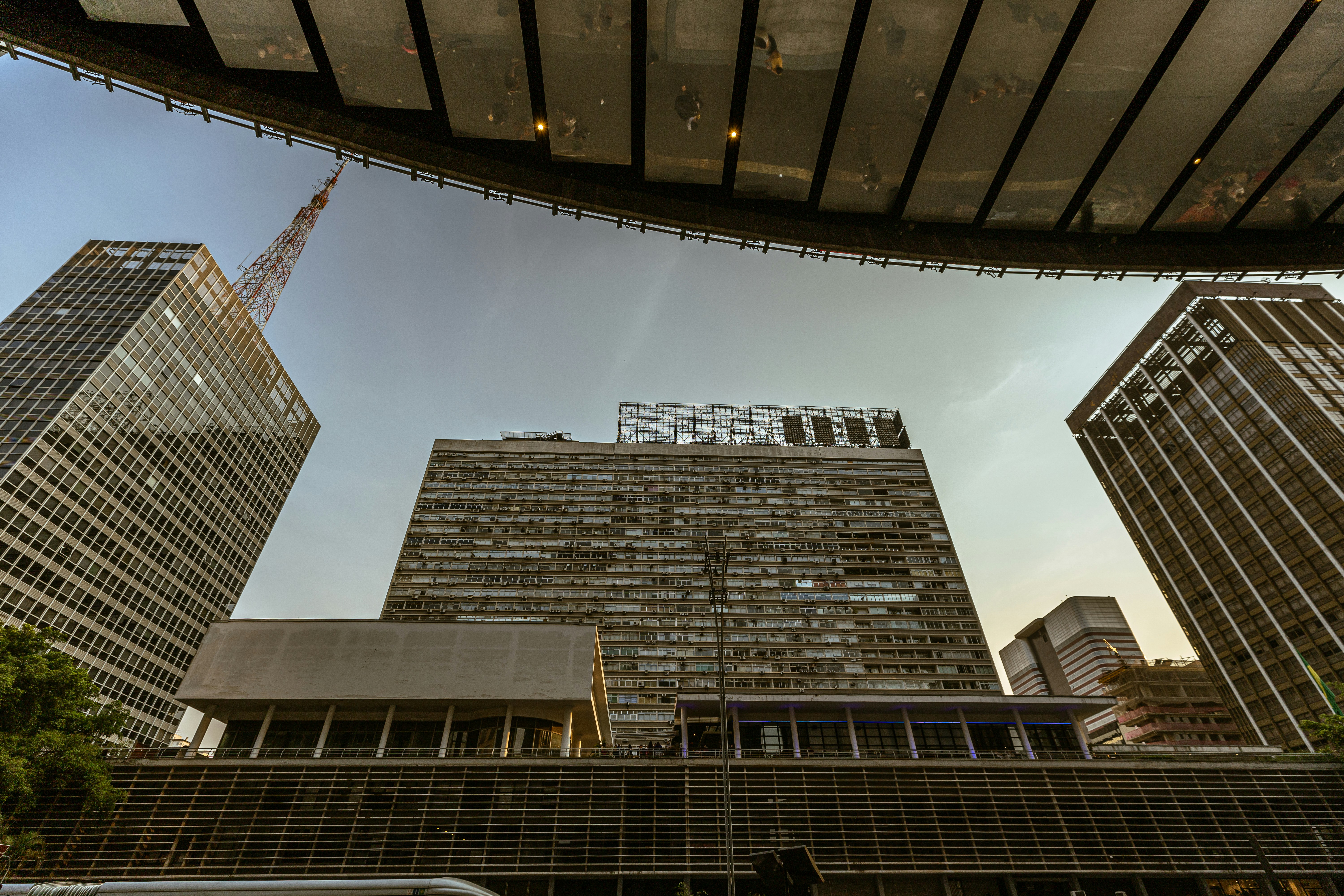 A group of tall buildings sitting next to each other photo – Free ...