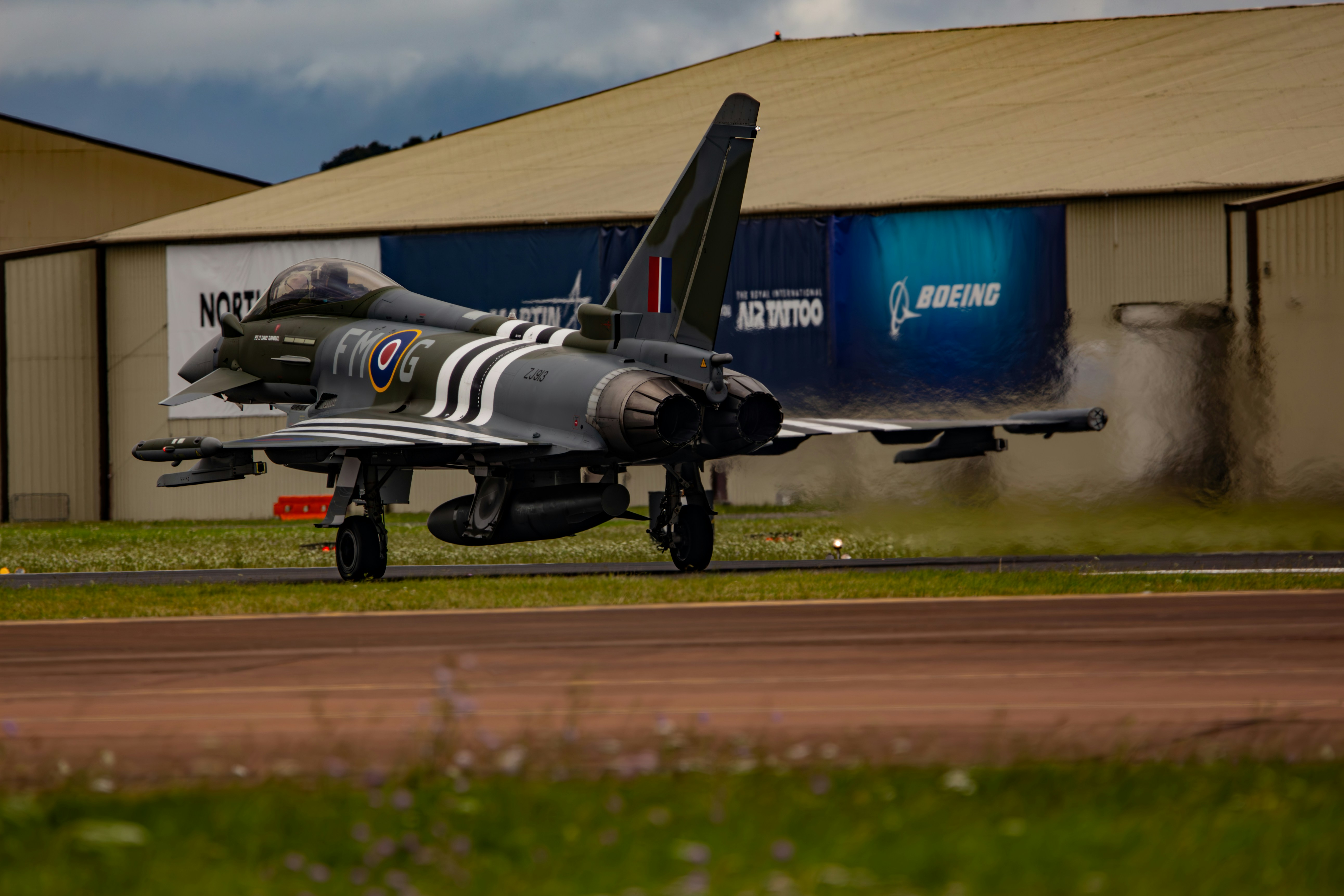 A fighter jet sitting on top of an airport runway photo – Free Aircraft ...