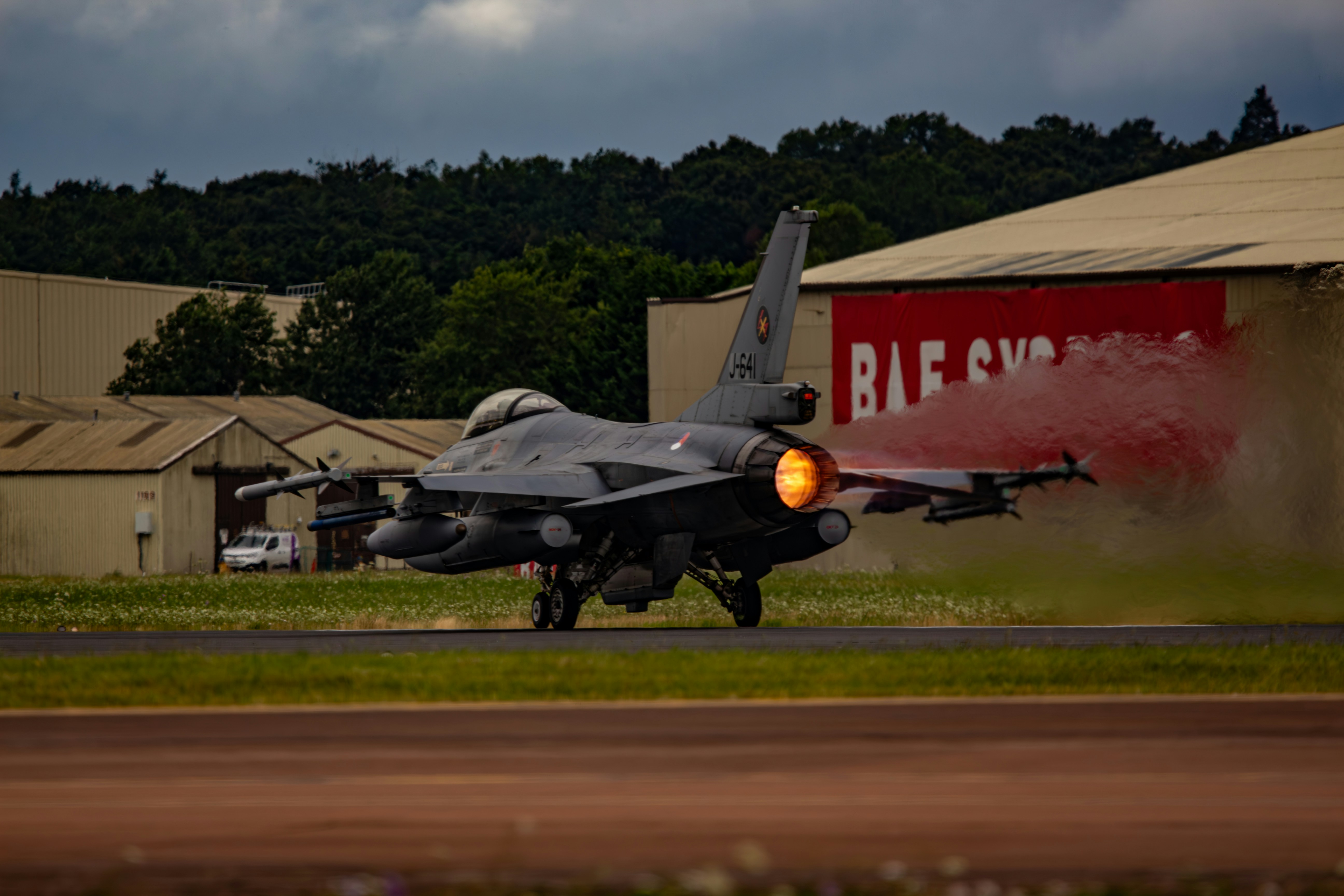 A fighter jet taking off from an airport runway photo – Free Aircraft ...