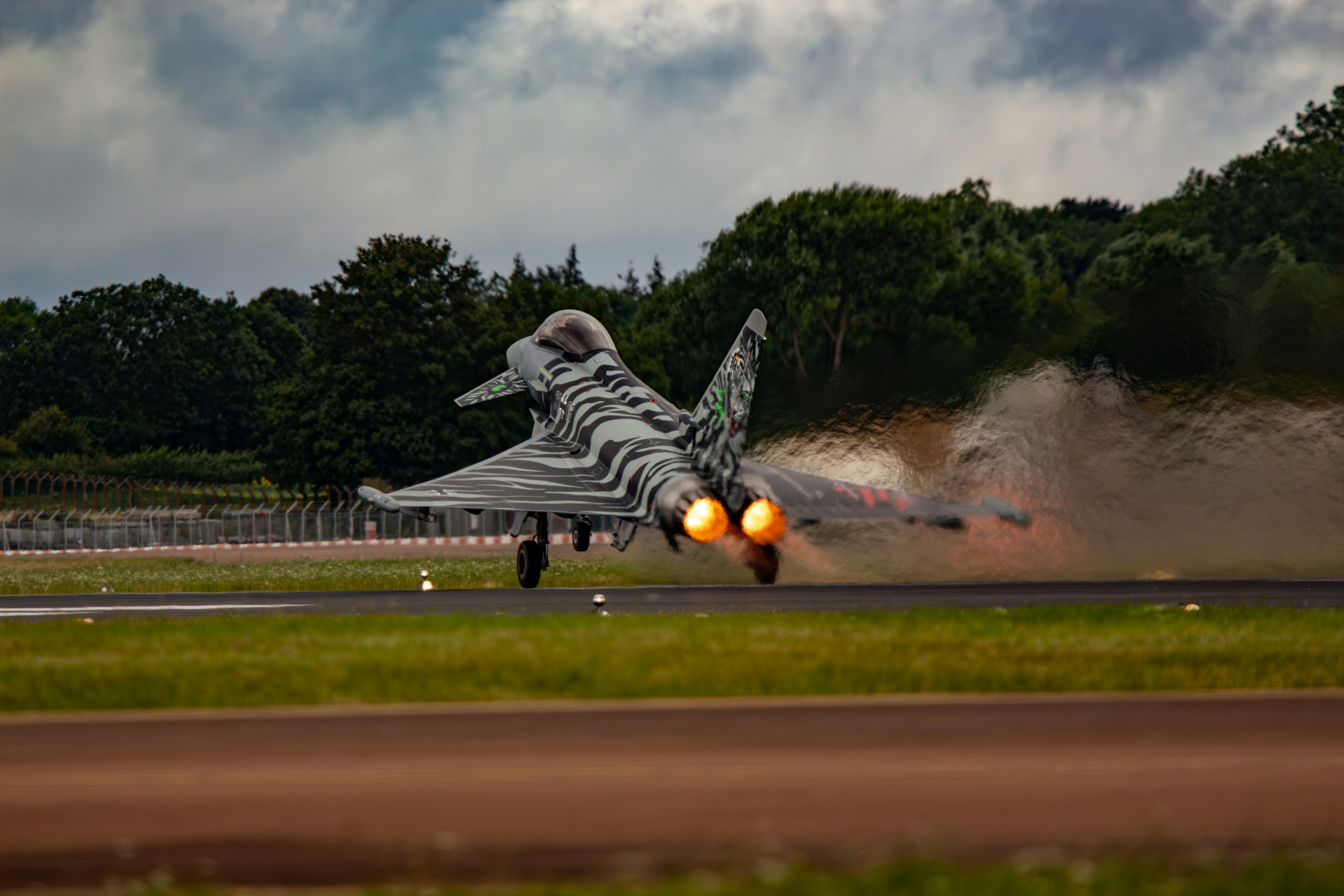 A fighter jet taking off from an airport runway photo – Free Airplane ...